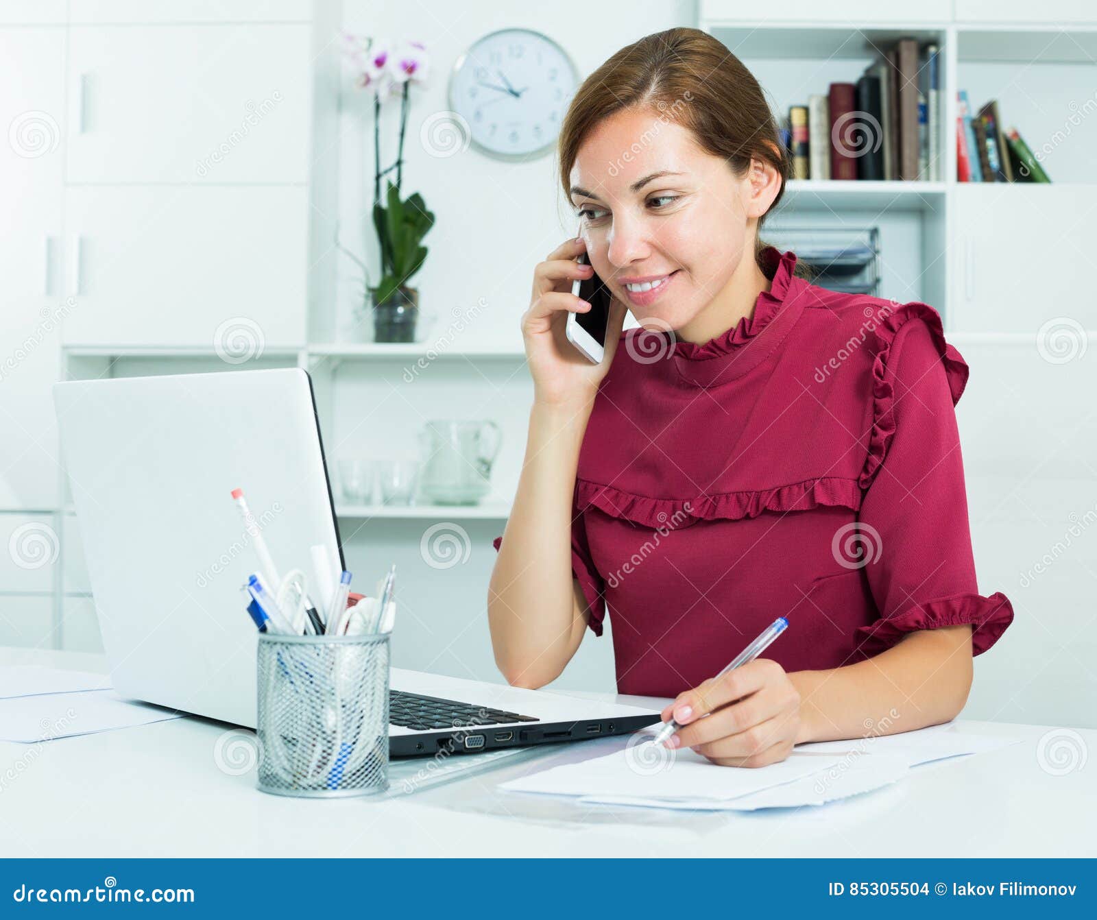 Woman Taking Notes while Talking Stock Photo - Image of mobile ...