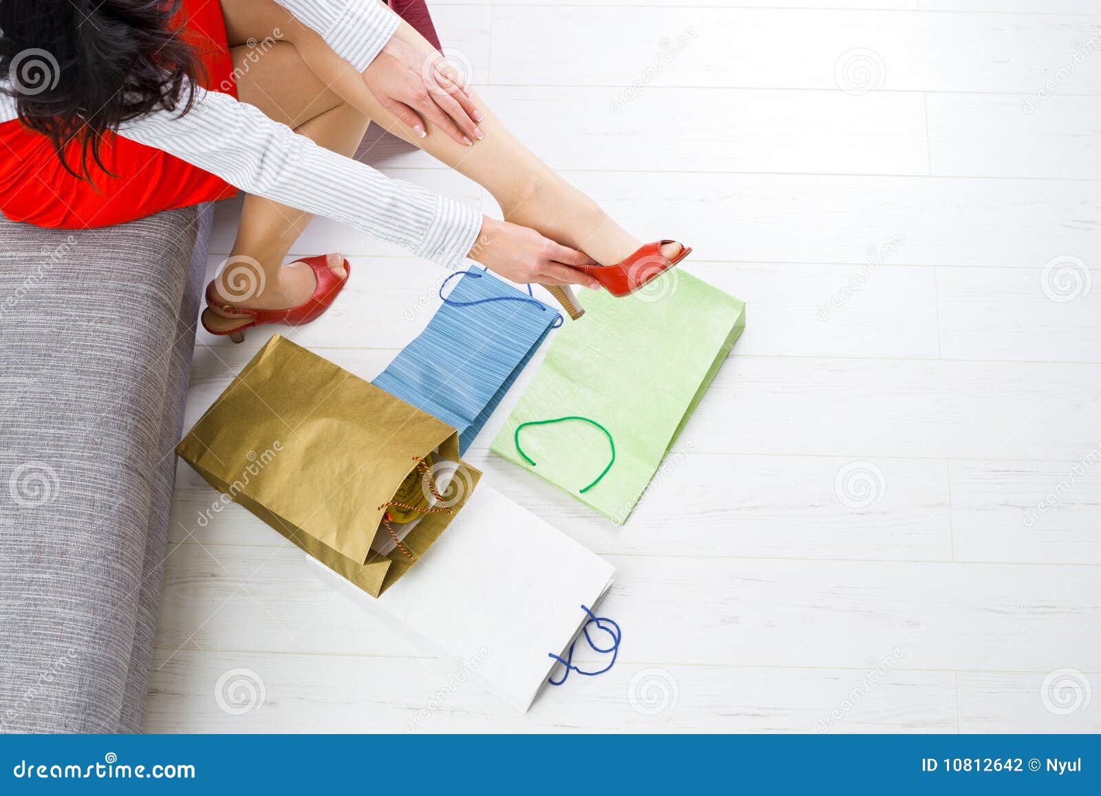 Woman taking off shoes stock photo. Image of attractive - 10812642