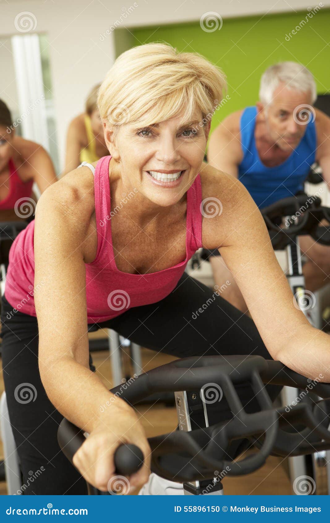Woman Taking Part in Spinning Class in Gym Stock Photo - Image of ...