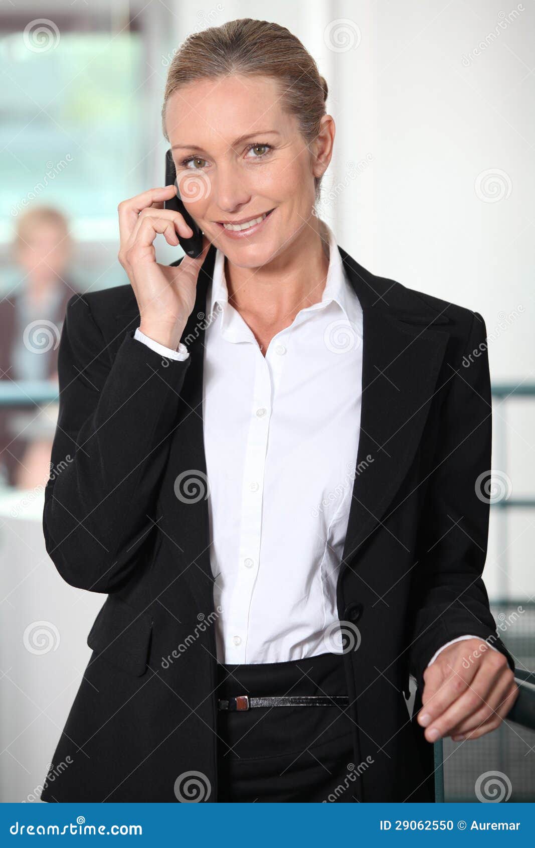 Woman taking a phone call stock photo. Image of cute - 29062550