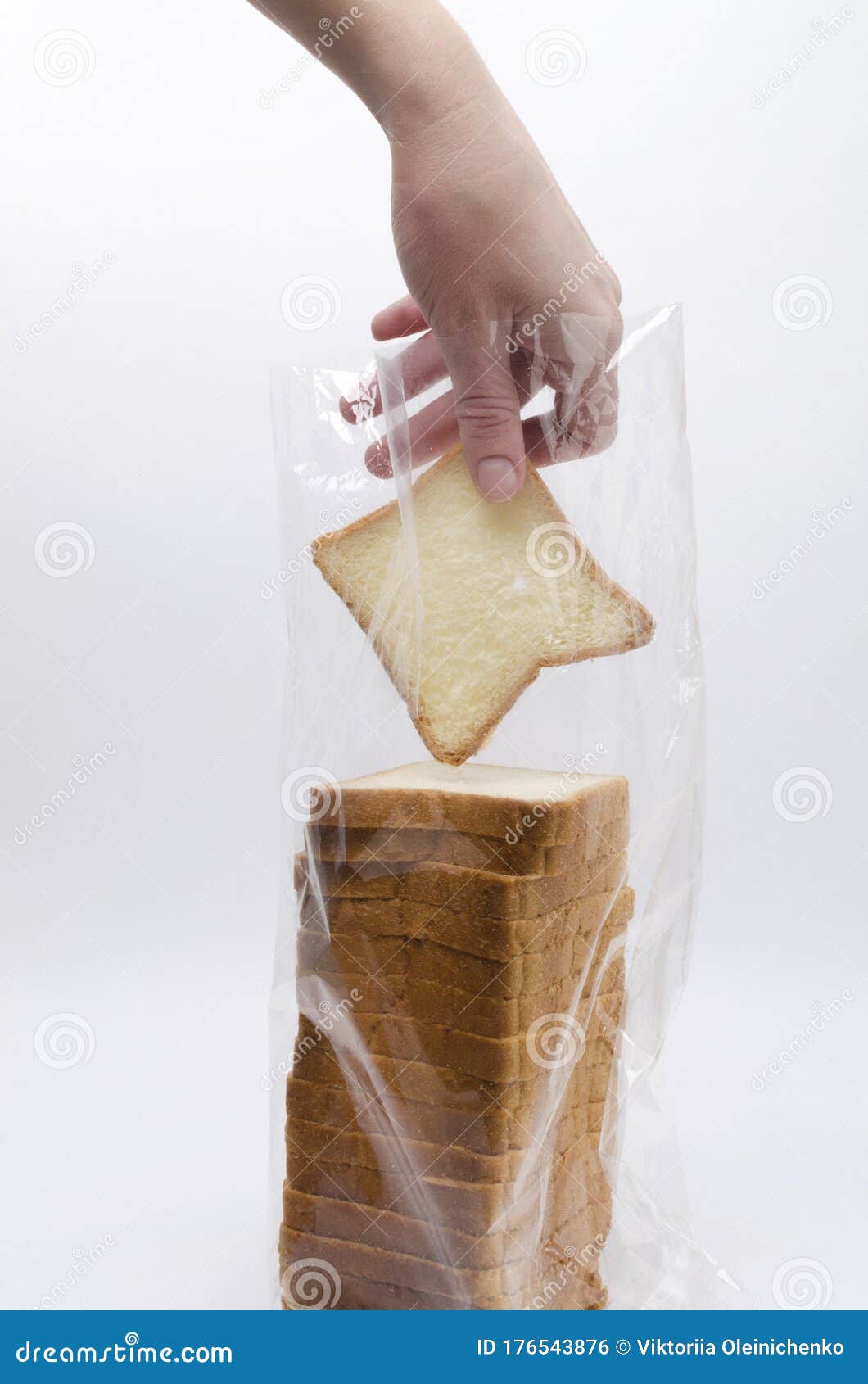 Woman Taking a Slice of White Bread for Toast.Stack of White Toast ...