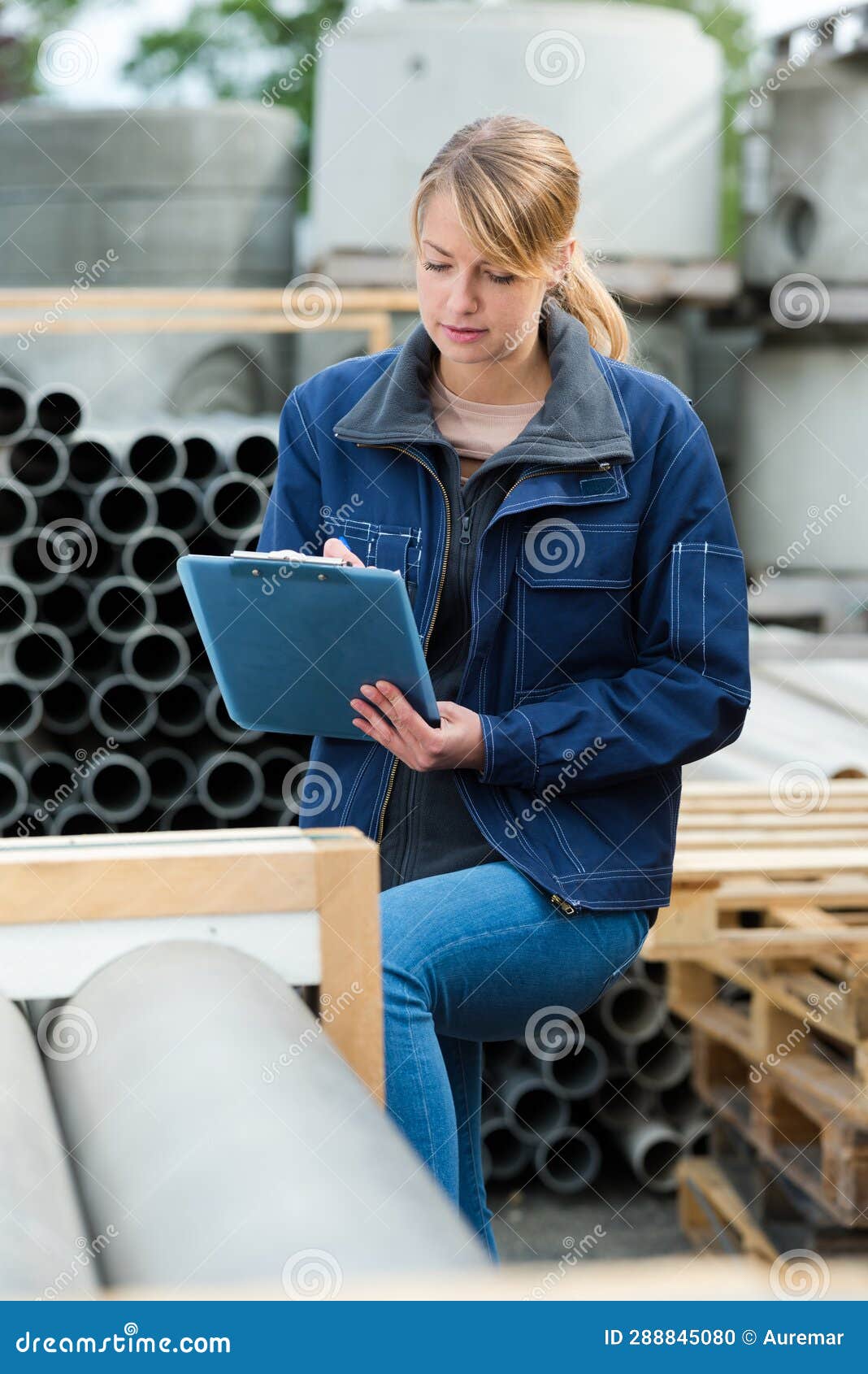 Woman Taking Stock in Warehouse Construction Company Stock Photo ...