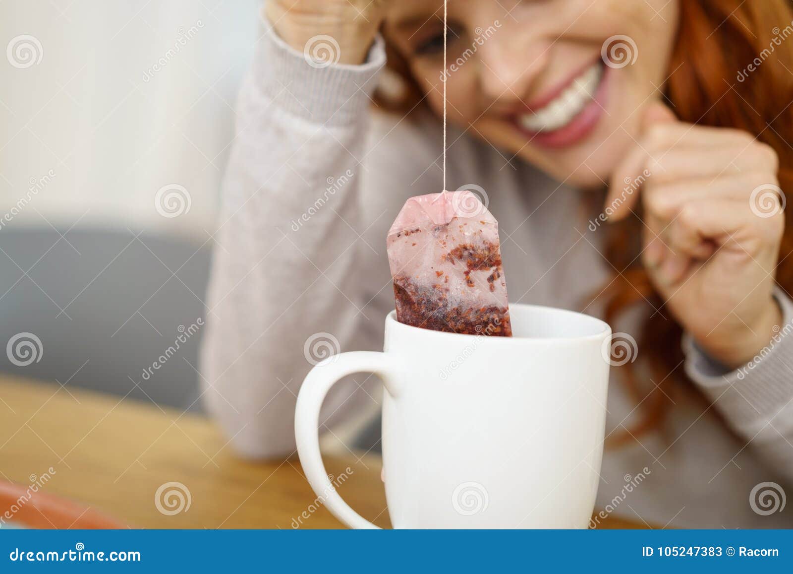Woman Taking Tea Bag Out of Mug Stock Image - Image of real, natural ...