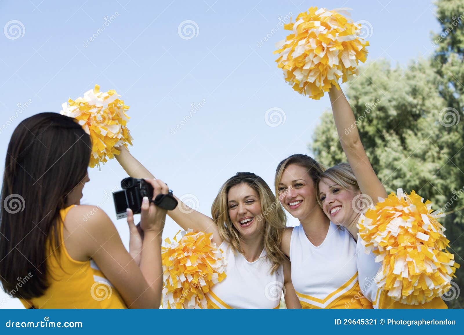Woman Taking Video of Cheerleaders Stock Image - Image of aged ...