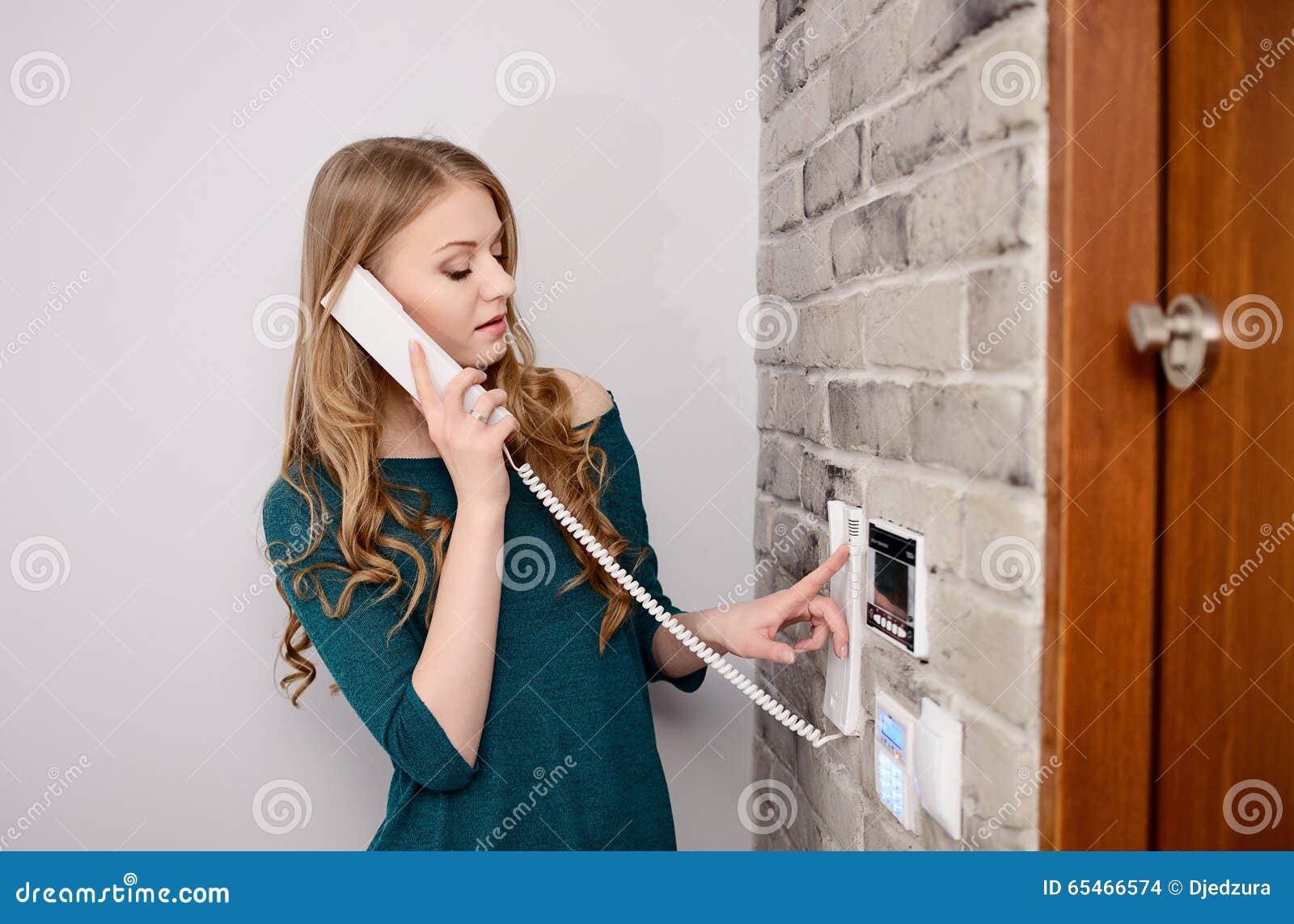 Woman Talking on the Intercom Stock Photo - Image of building, intercom ...