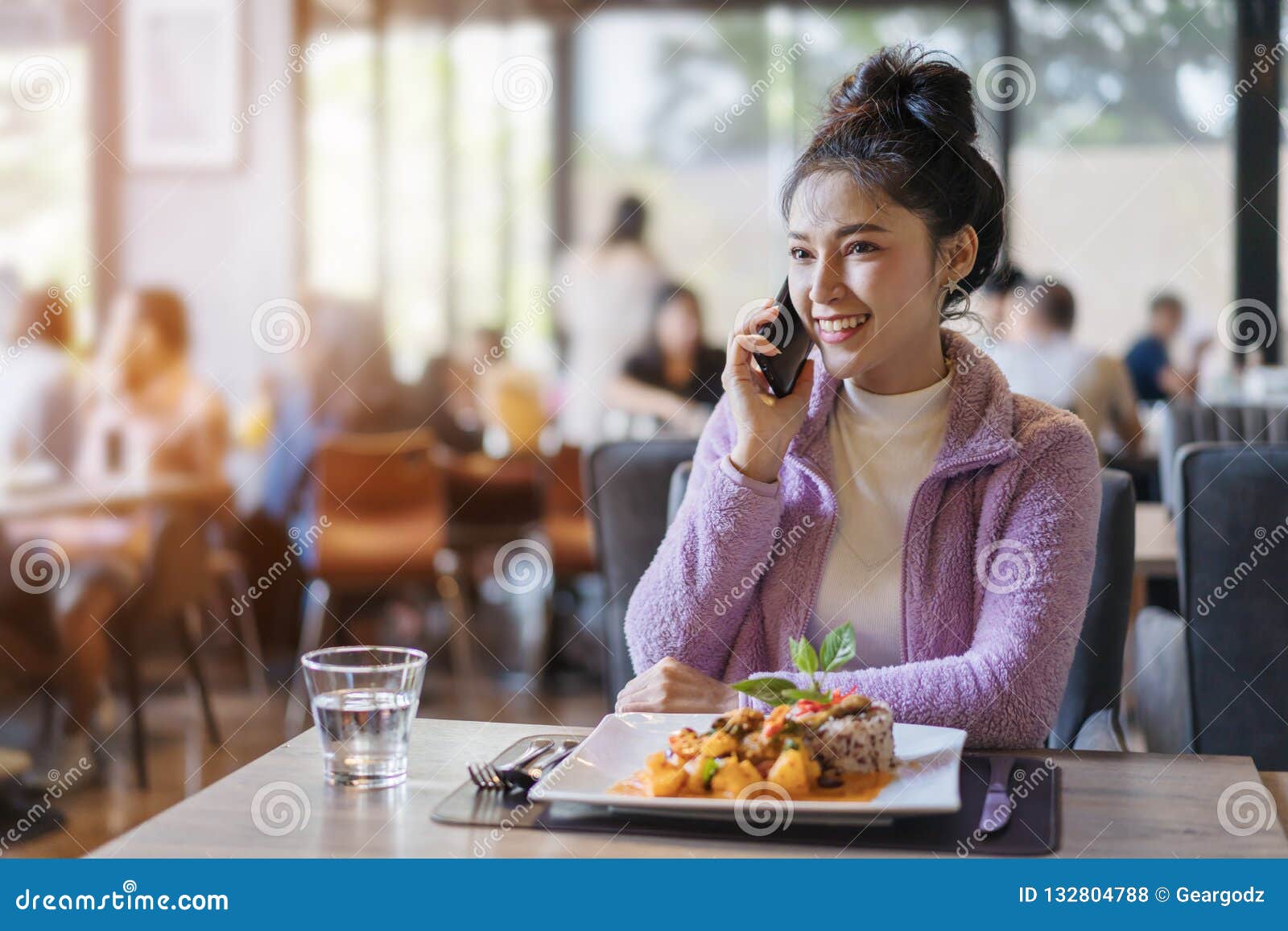 Woman Talking on Mobile Phone in Restaurant Stock Photo - Image of ...