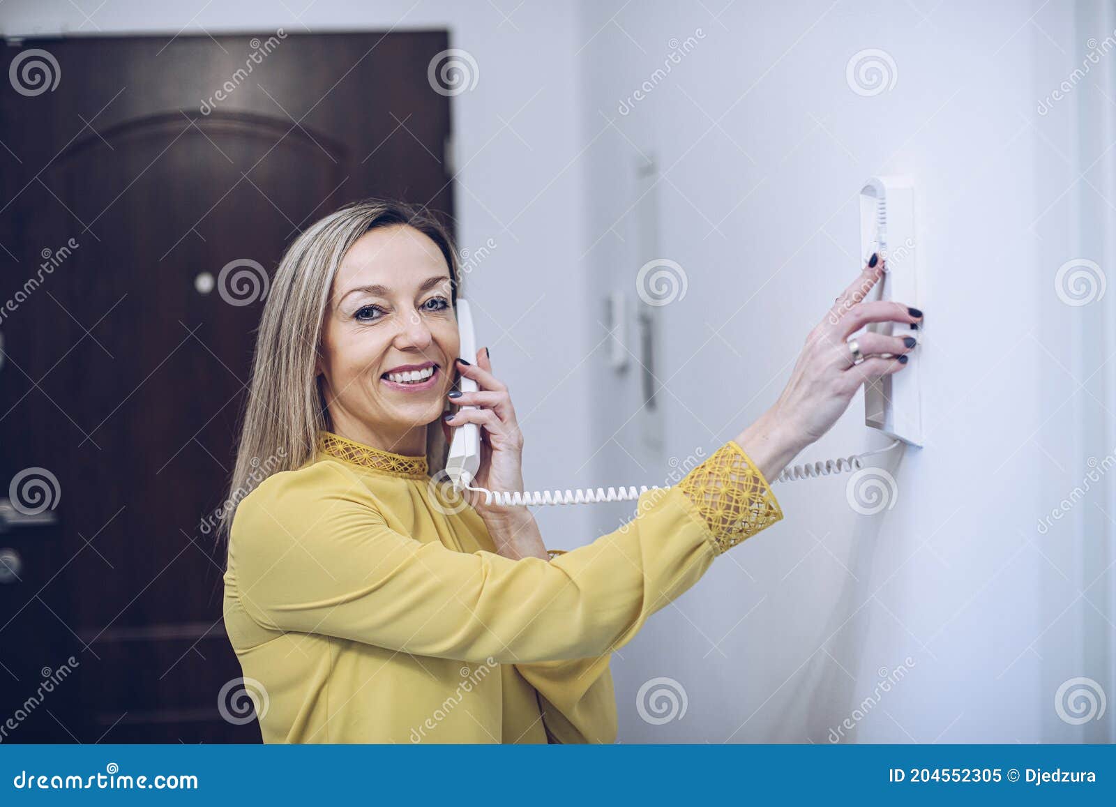 Woman Talking and Opening Doors with Intercom Stock Image - Image of ...