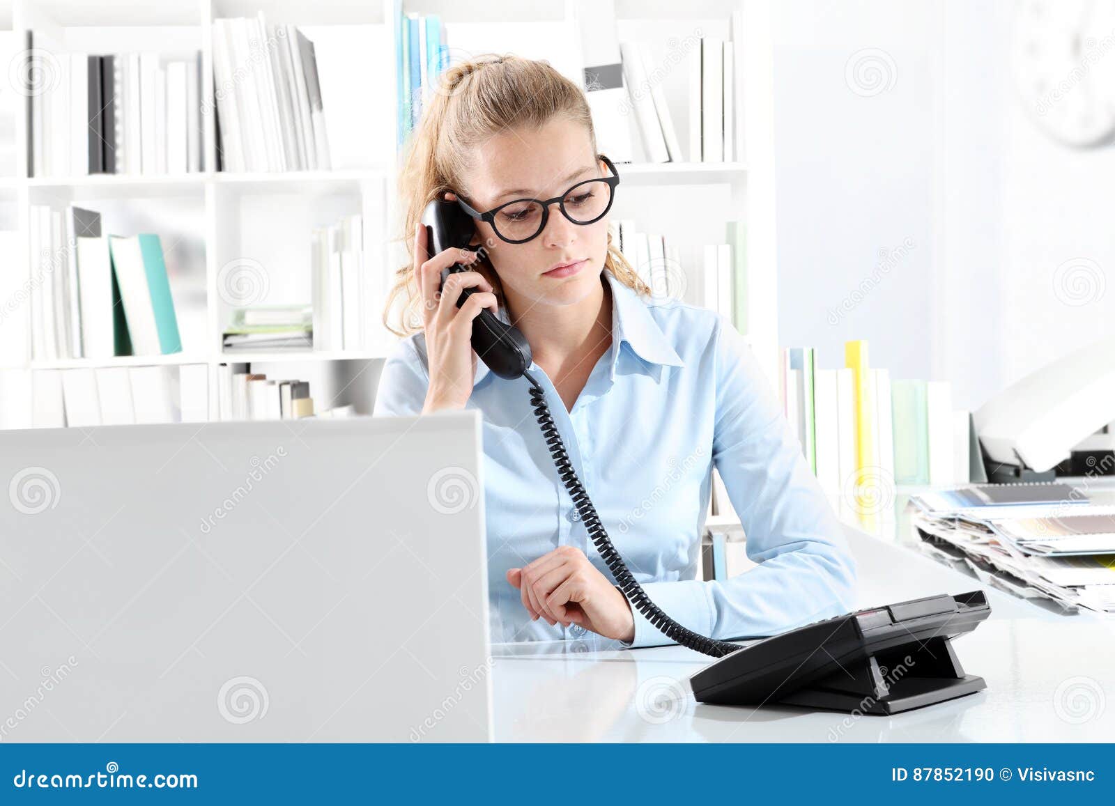 Woman Talking on Phone in Office at Desk in Front Computer Stock Photo ...