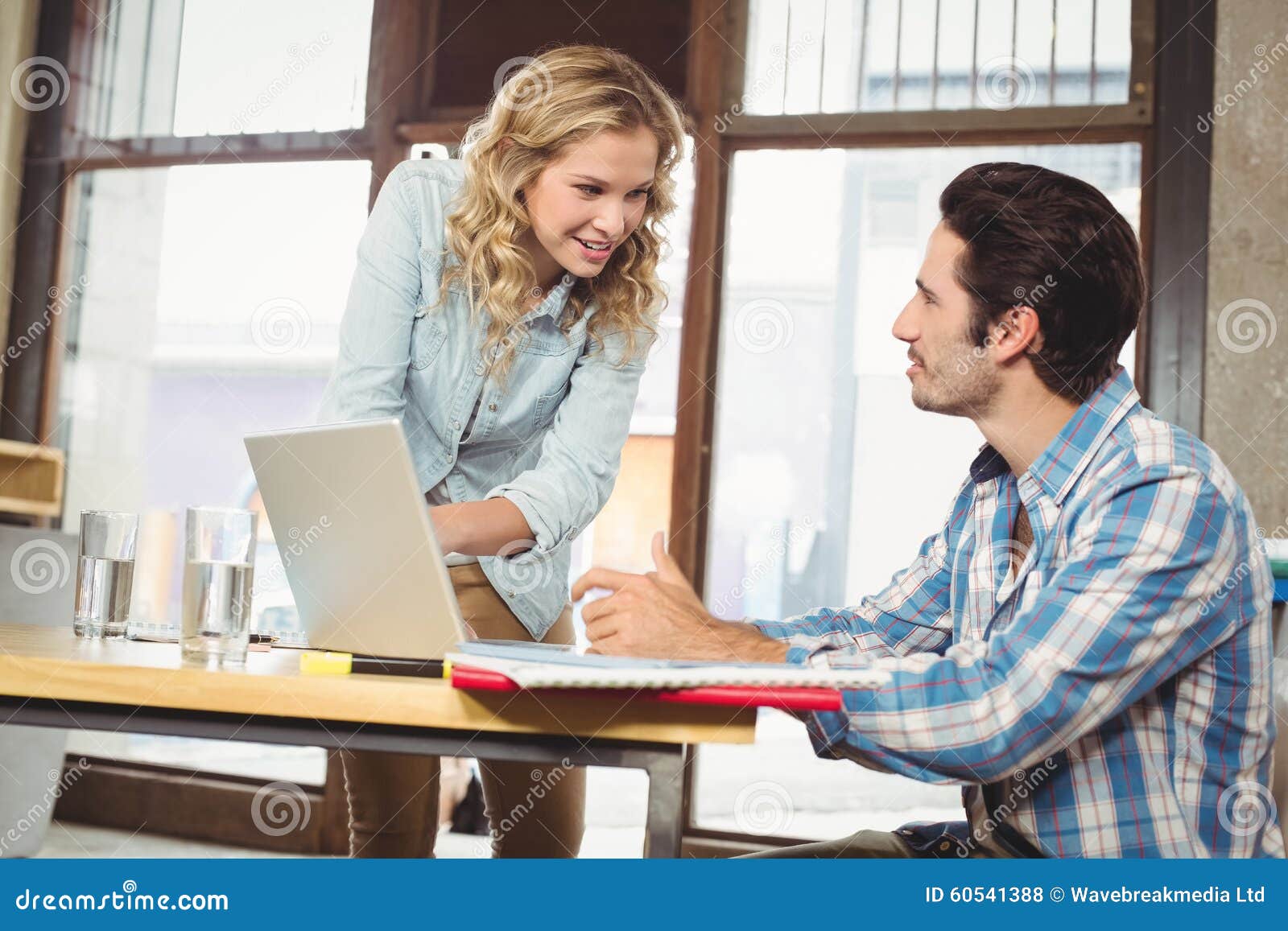 Woman talking to colleague stock photo. Image of happiness - 60541388