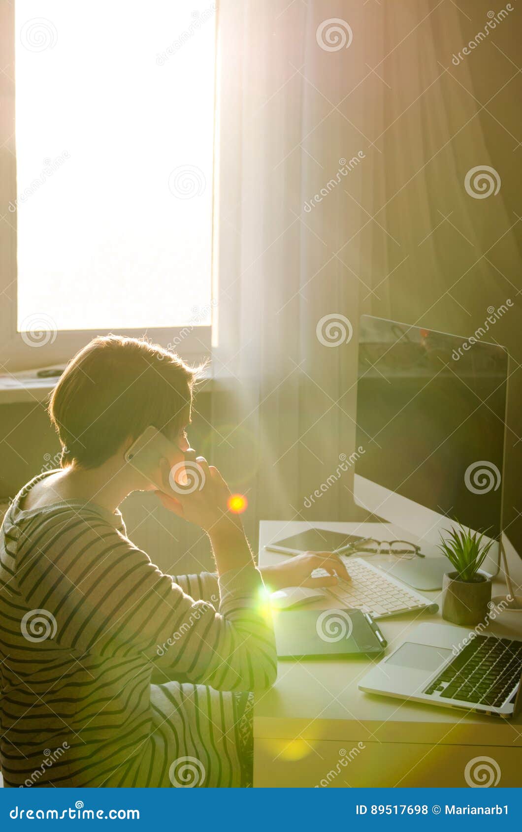 Woman Talking To Smartphone and Watching on Different Devices Stock ...
