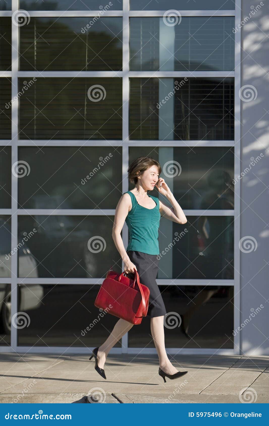 Woman Talks on Phone while Running - Vertical Stock Photo - Image of ...