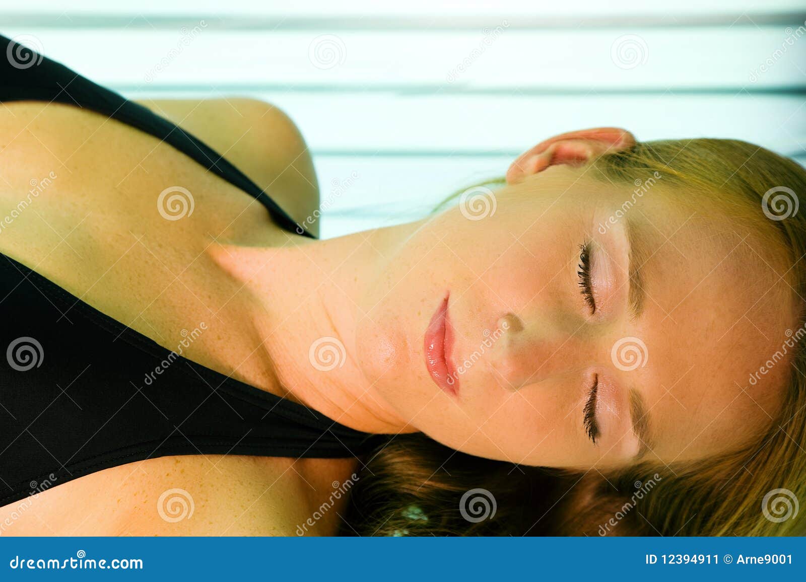 Woman tanning in solarium stock image. Image of procedure - 12394911