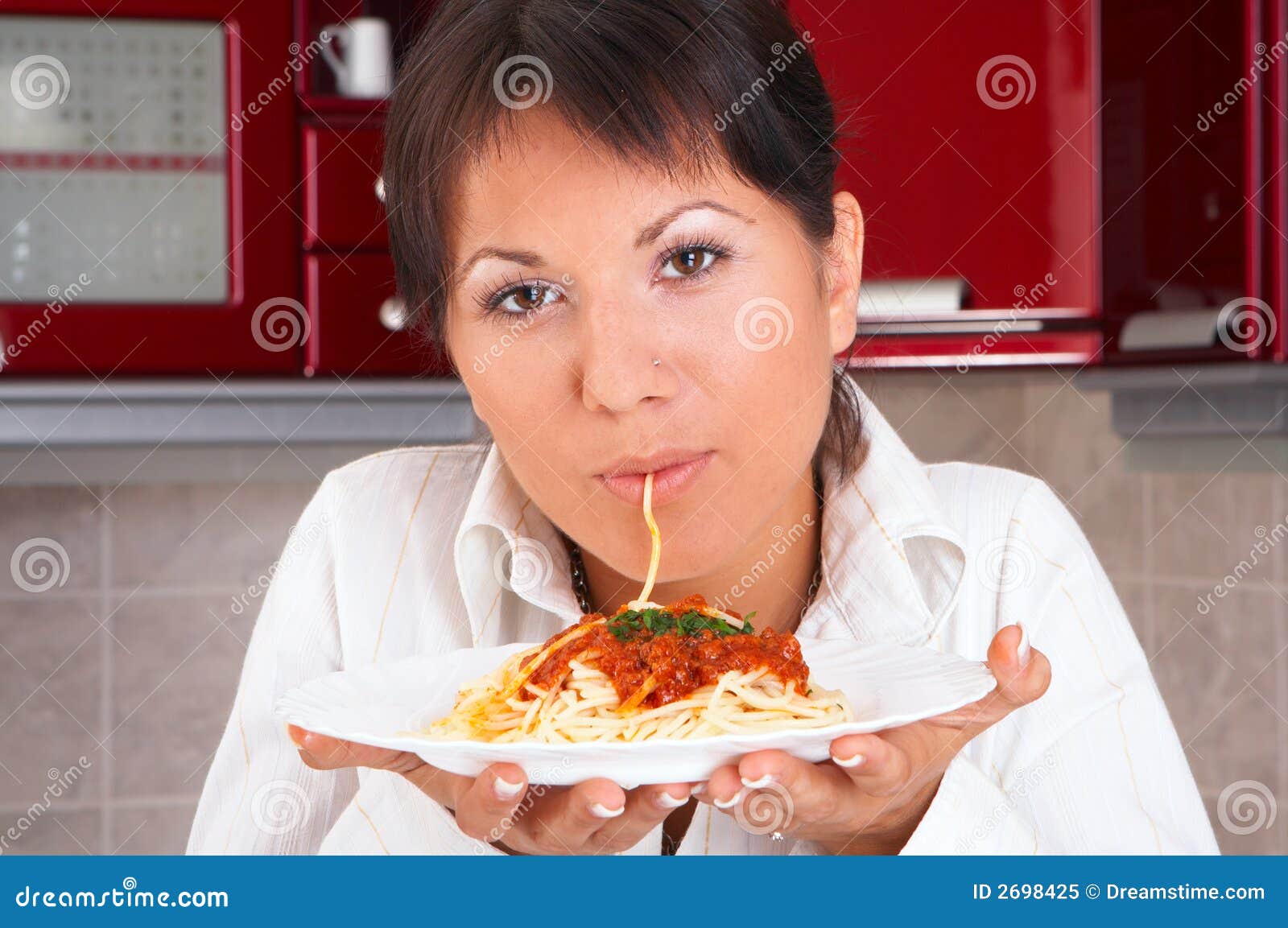 Woman taste pasta stock image. Image of meal, hands, food - 2698425