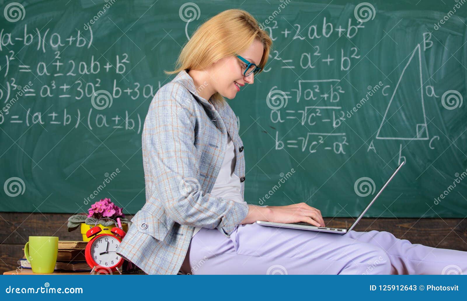 Woman Teacher Hold Laptop Sit Table Classroom Chalkboard Background ... Woman Teacher Hold Laptop Sit Table Classroom Chalkboard Background ...