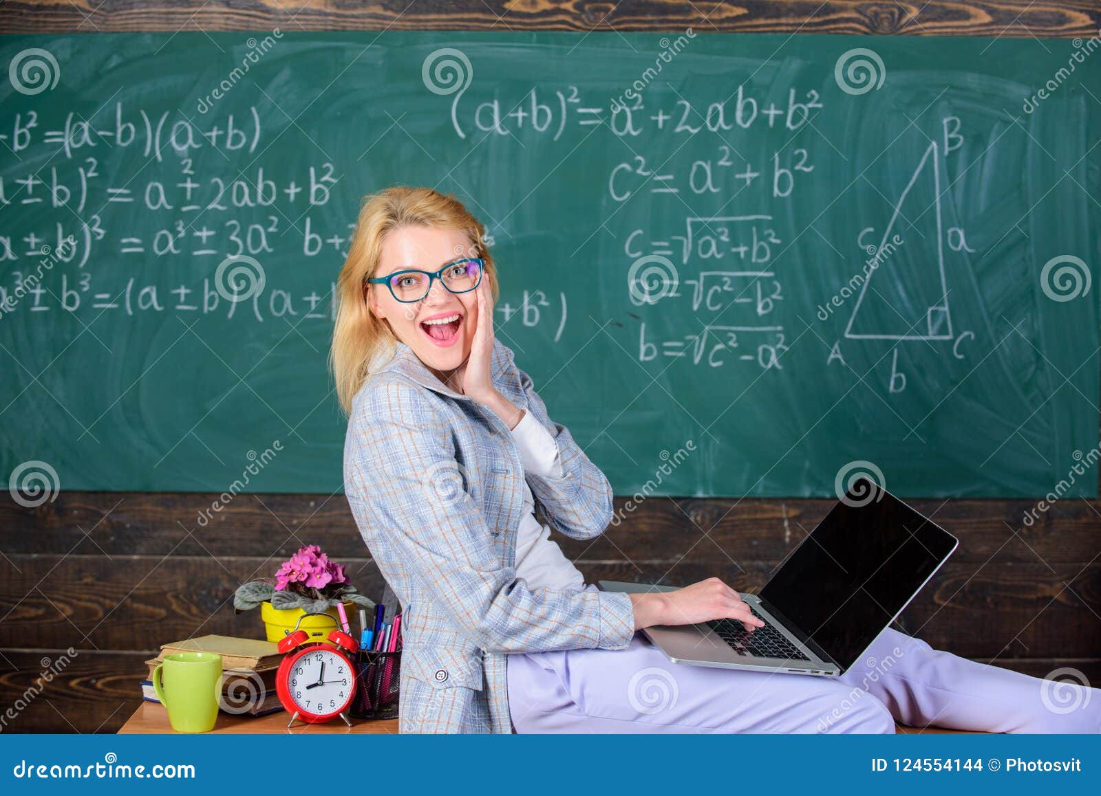 Woman Teacher Hold Laptop Sit Table Classroom Chalkboard Background ... Woman Teacher Hold Laptop Sit Table Classroom Chalkboard Background ...