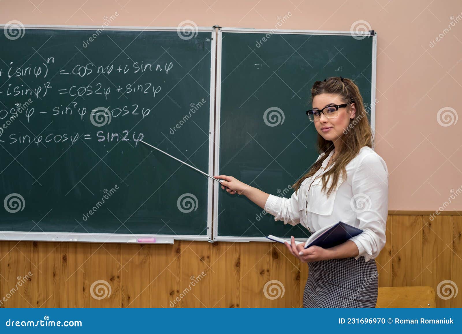 Woman Teacher Writed Mathematical Formulas on the Blackboard and ...