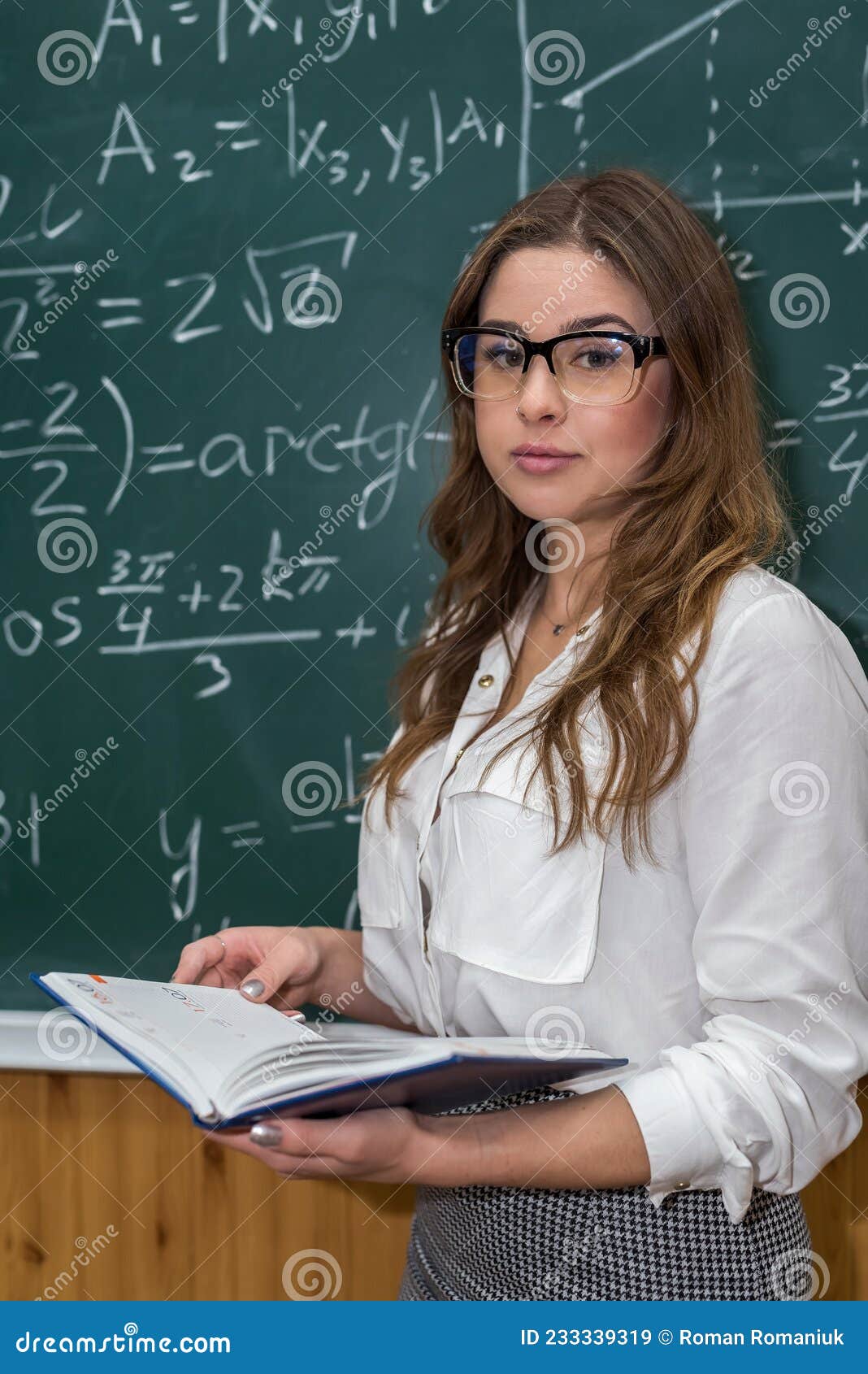 Woman Teacher Writed Mathematical Formulas on the Blackboard and ...