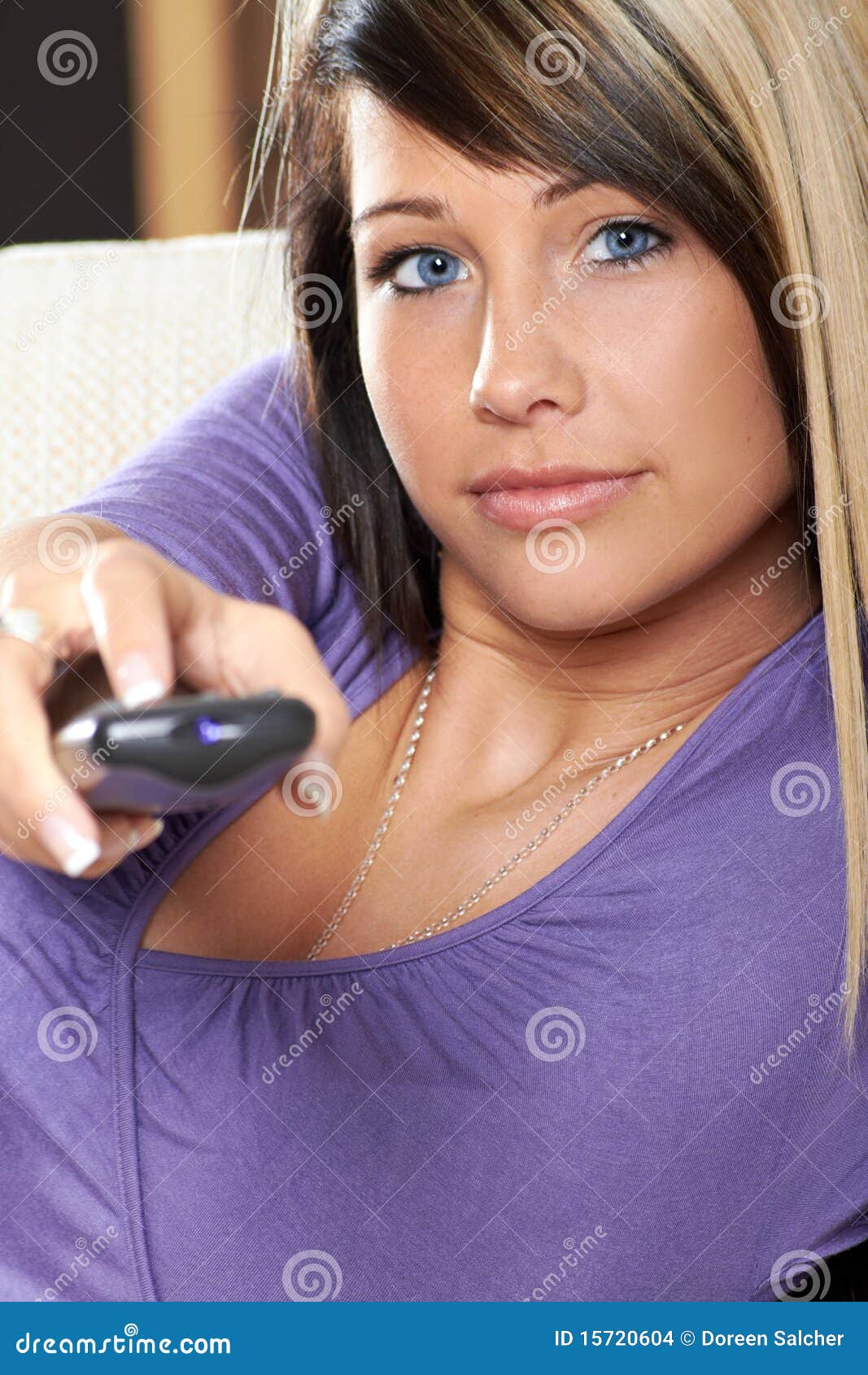Woman with a Television Remote Stock Photo - Image of pretty, inside ...