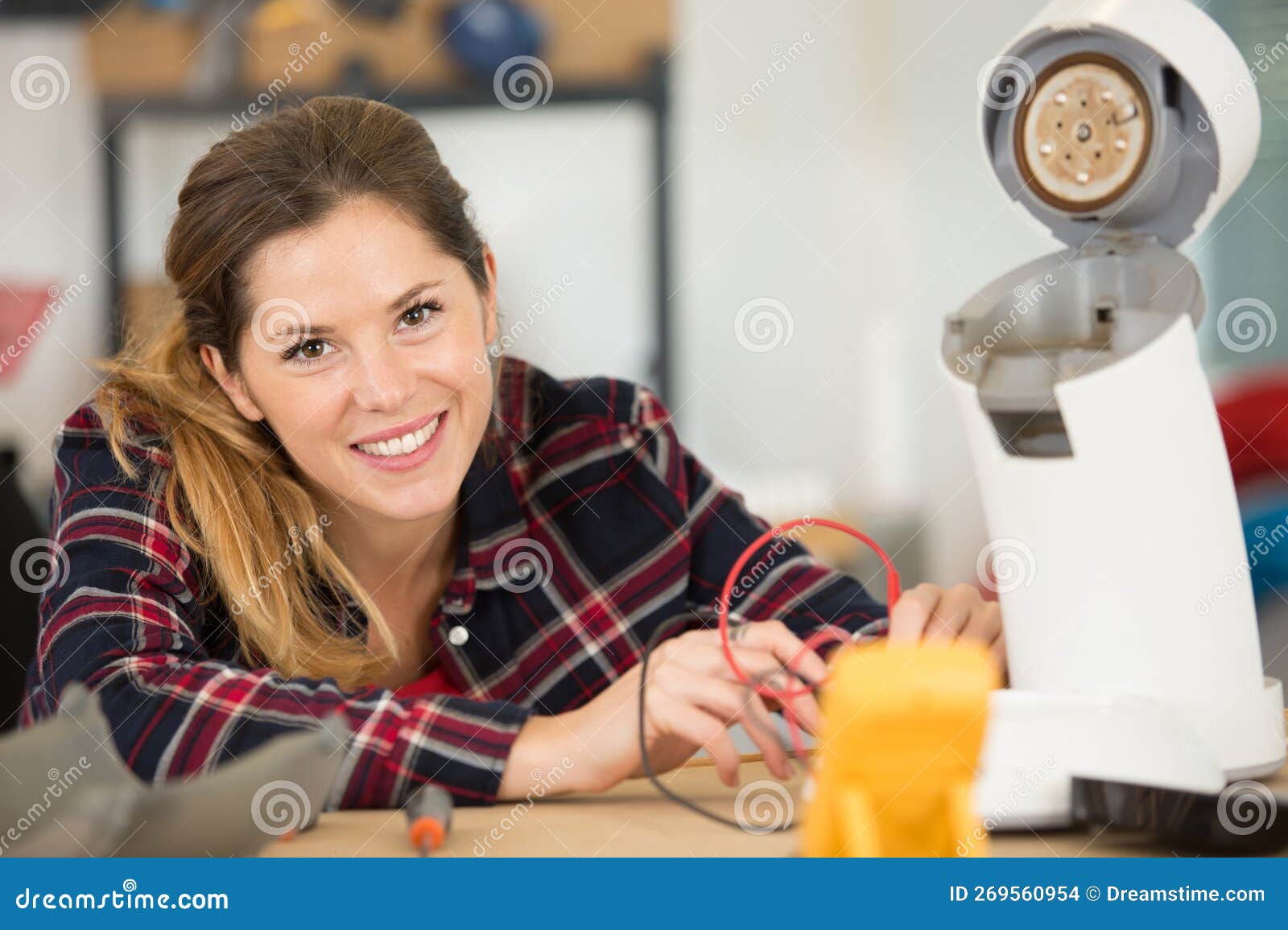 Woman Testing Appliance with Multimeter Stock Photo - Image of ...