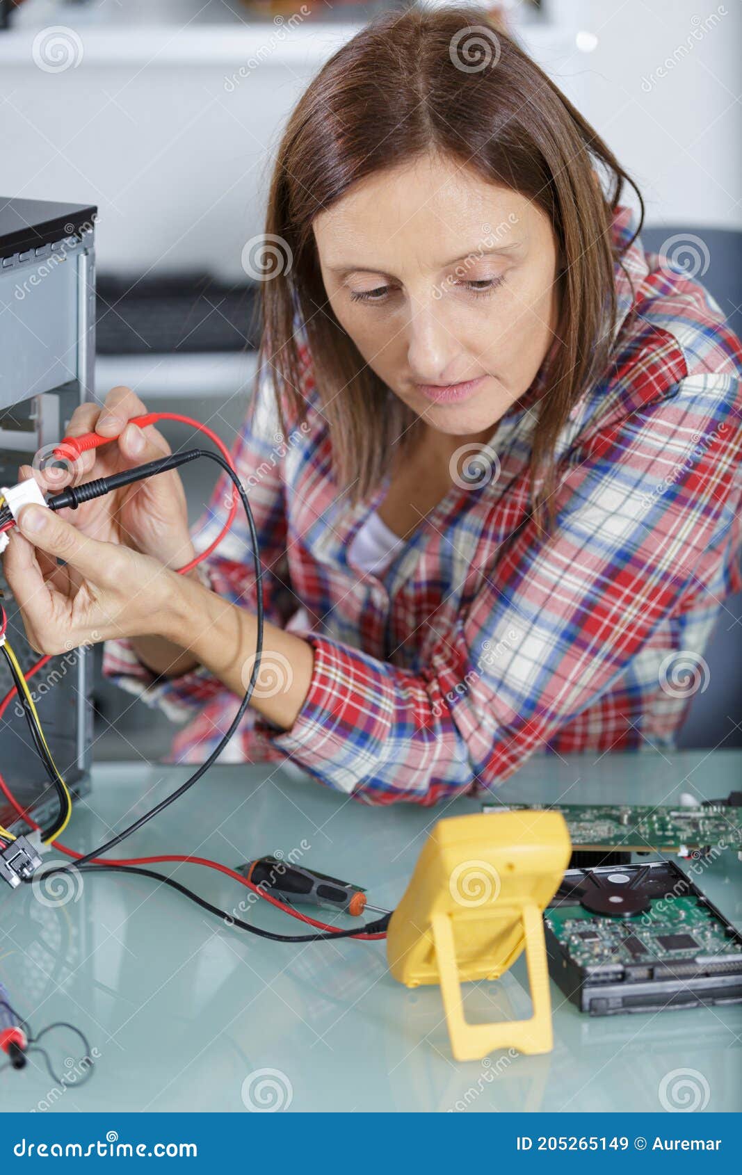 Woman testing motherboard stock image. Image of computer - 205265149