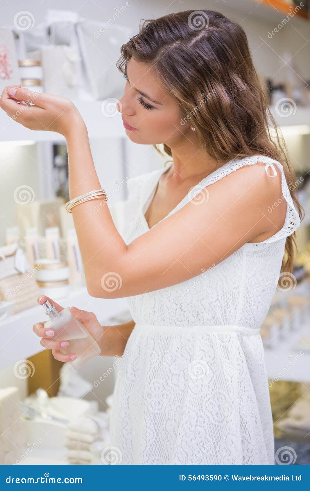 Woman testing perfume stock photo. Image of - 56493590
