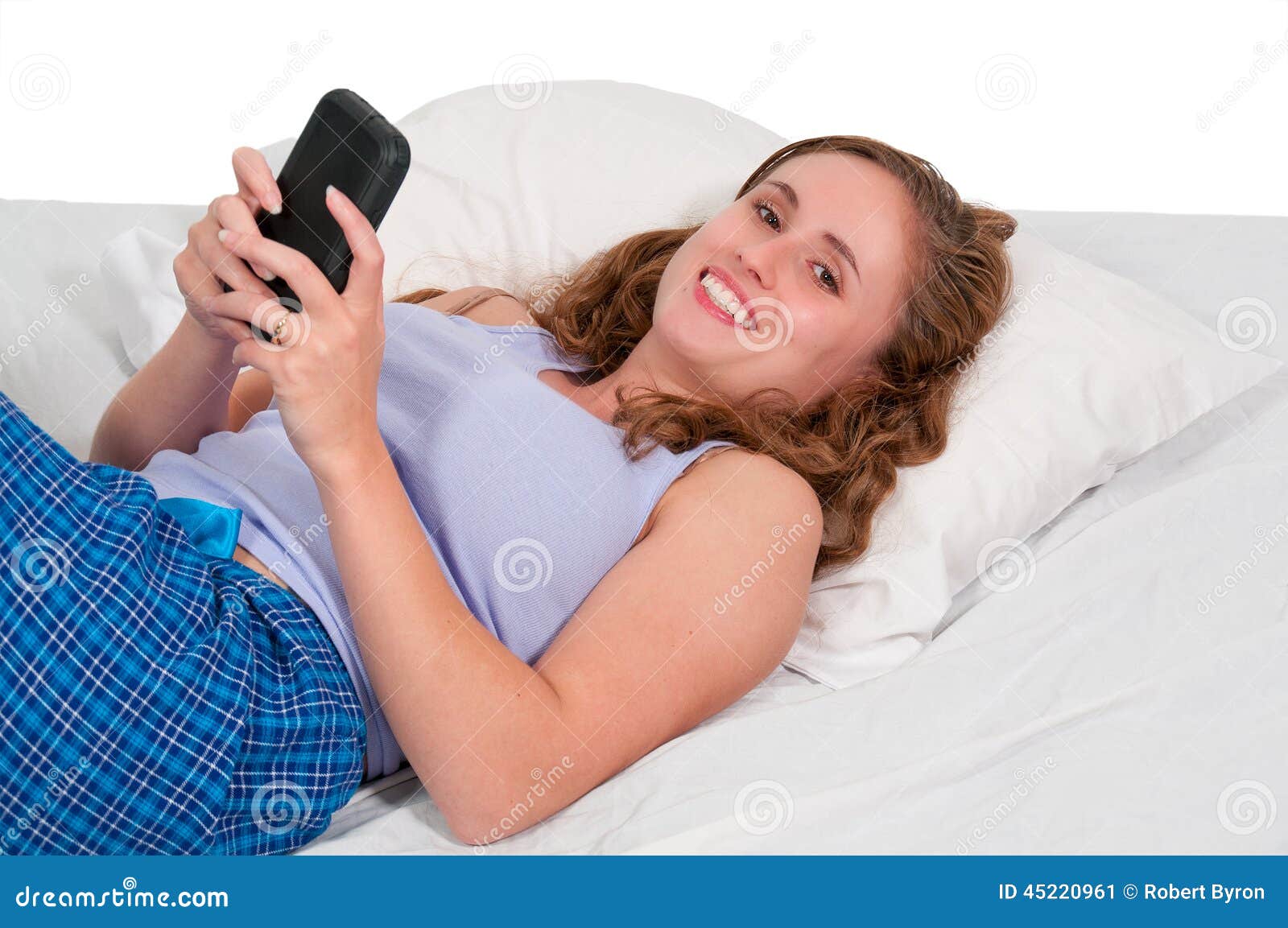 Woman Texting in Bed stock image. Image of leisure, cellular - 45220961