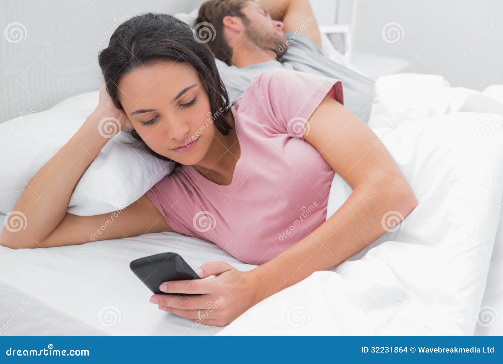 Woman Texting while Her Partner is Sleeping Stock Photo - Image of ... Woman Texting while Her Partner is Sleeping Stock Photo - Image of ...