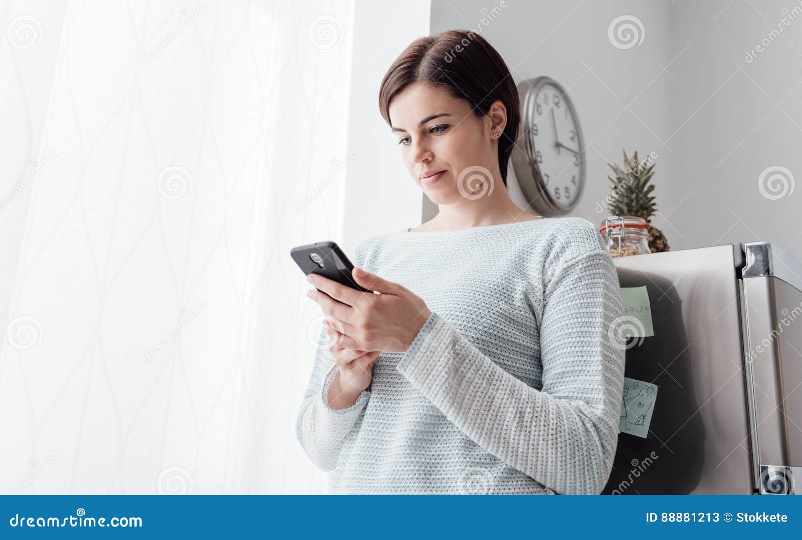 Woman Texting in the Kitchen Stock Image - Image of casual ...