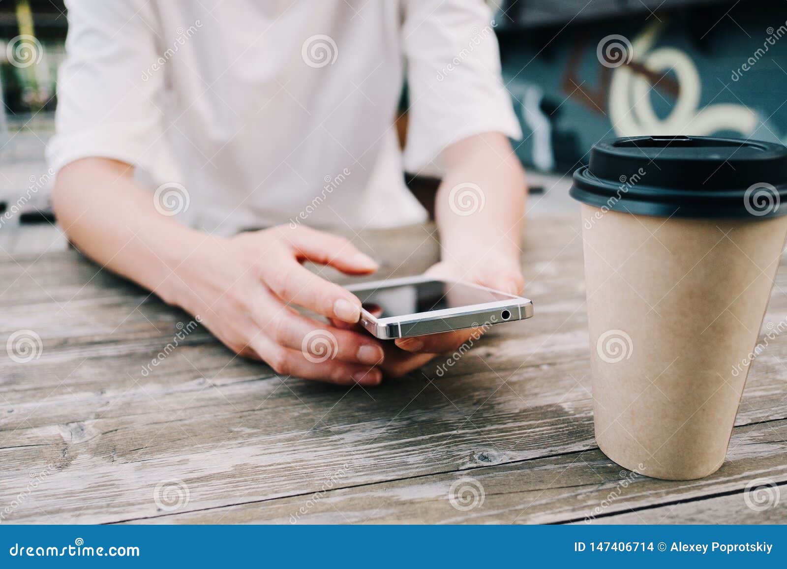 Woman Texting a Message while Sitting with Cup of Coffee. Stock Photo ...