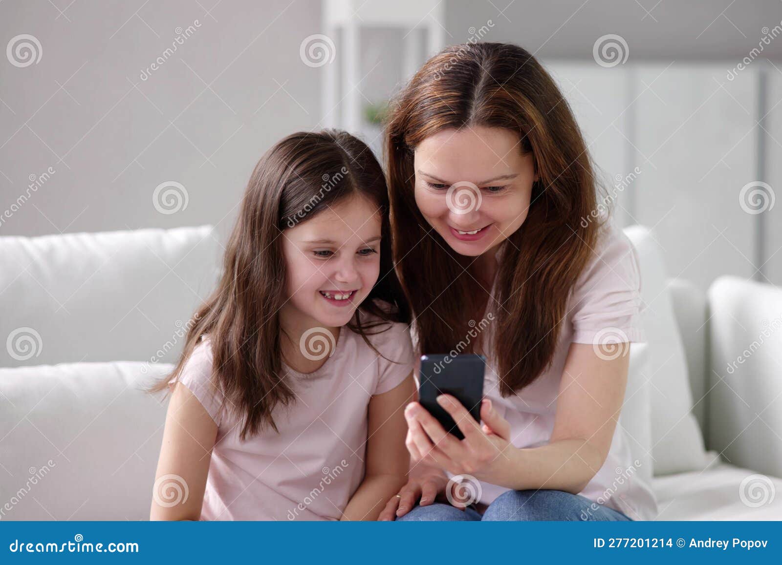 Woman Texting on Phone with Child Stock Photo - Image of mobile, family ...