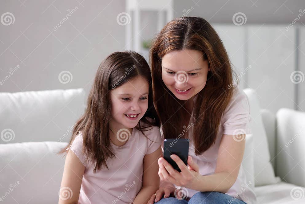 Woman Texting on Phone with Child Stock Photo - Image of mobile, family ...