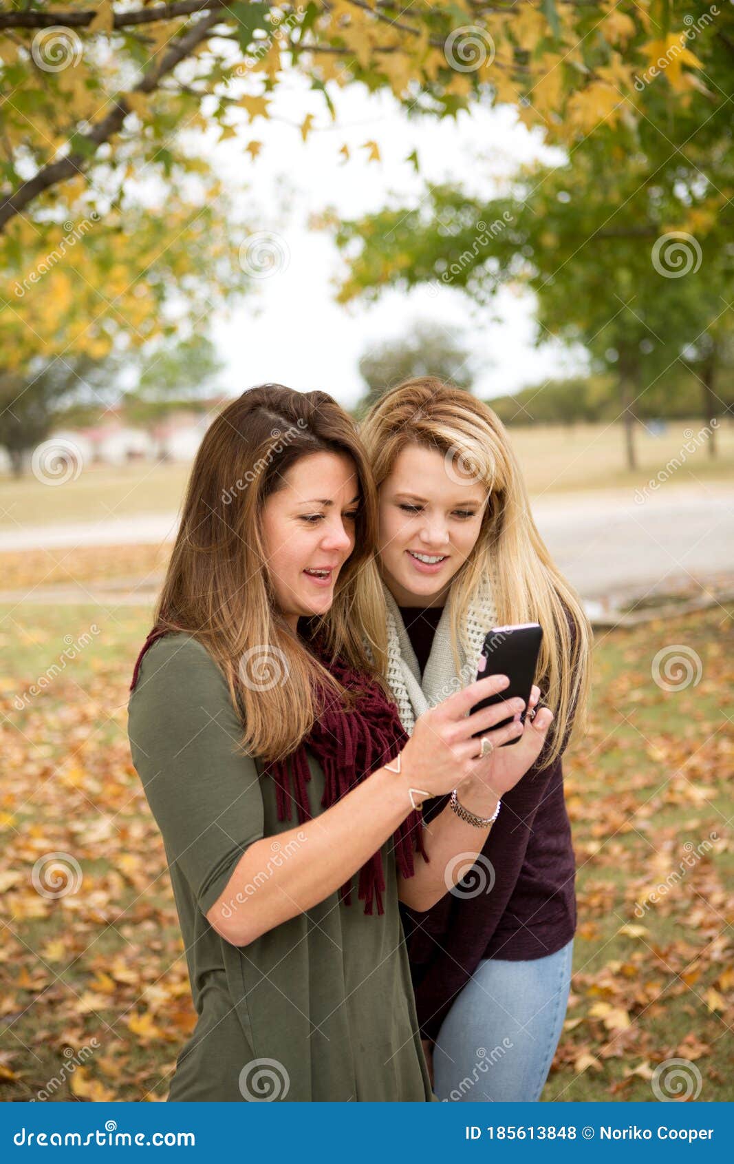 Woman Texting and Talking Outside in the Fall. Stock Photo - Image of ...