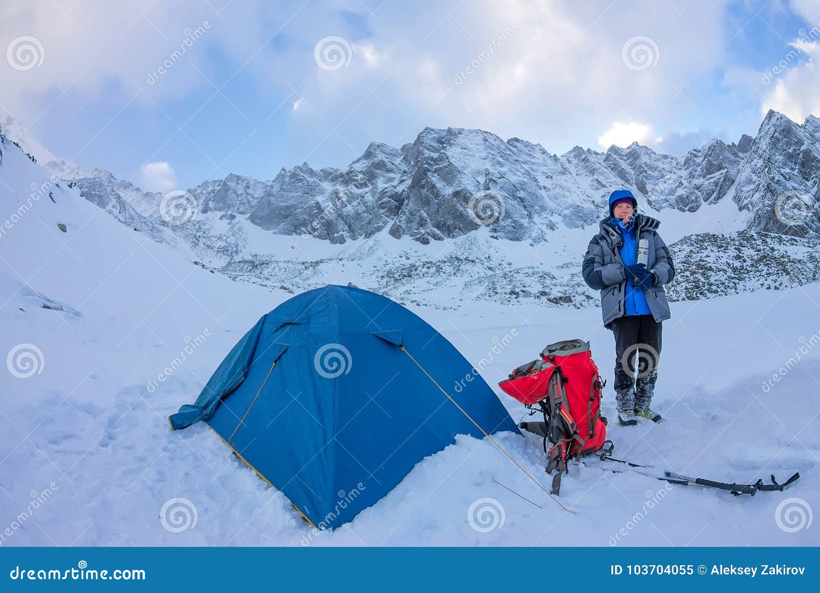 Woman with a Thermos at Blue Tent in the Base Camp in the Mountains ...