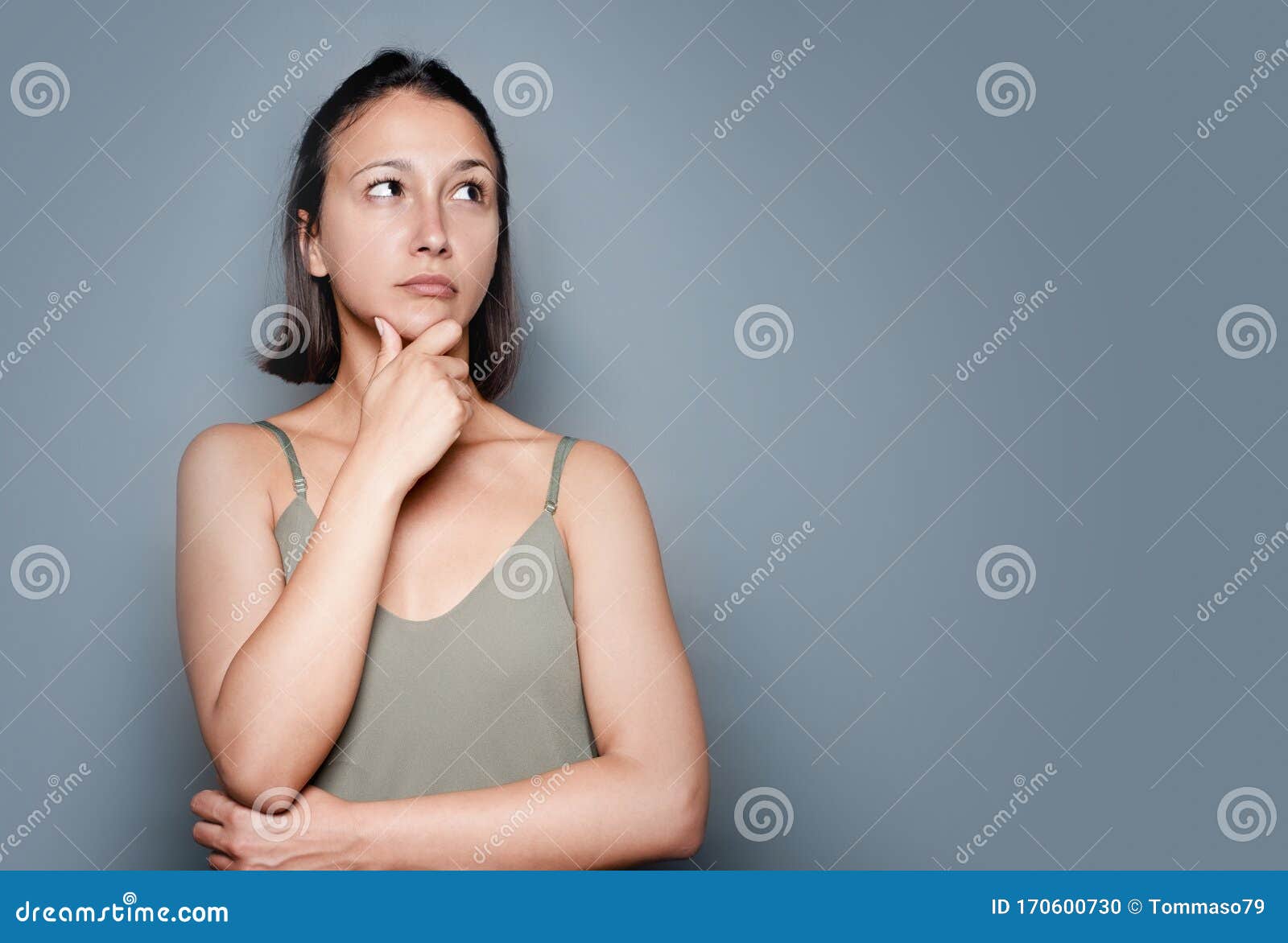 Woman with Thinking Face Expression on Gray Background Stock Photo ...