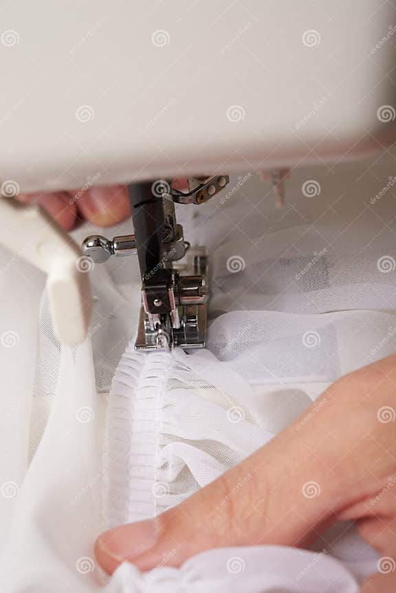 Woman Threading on Sewing Machine Stock Image - Image of background ...