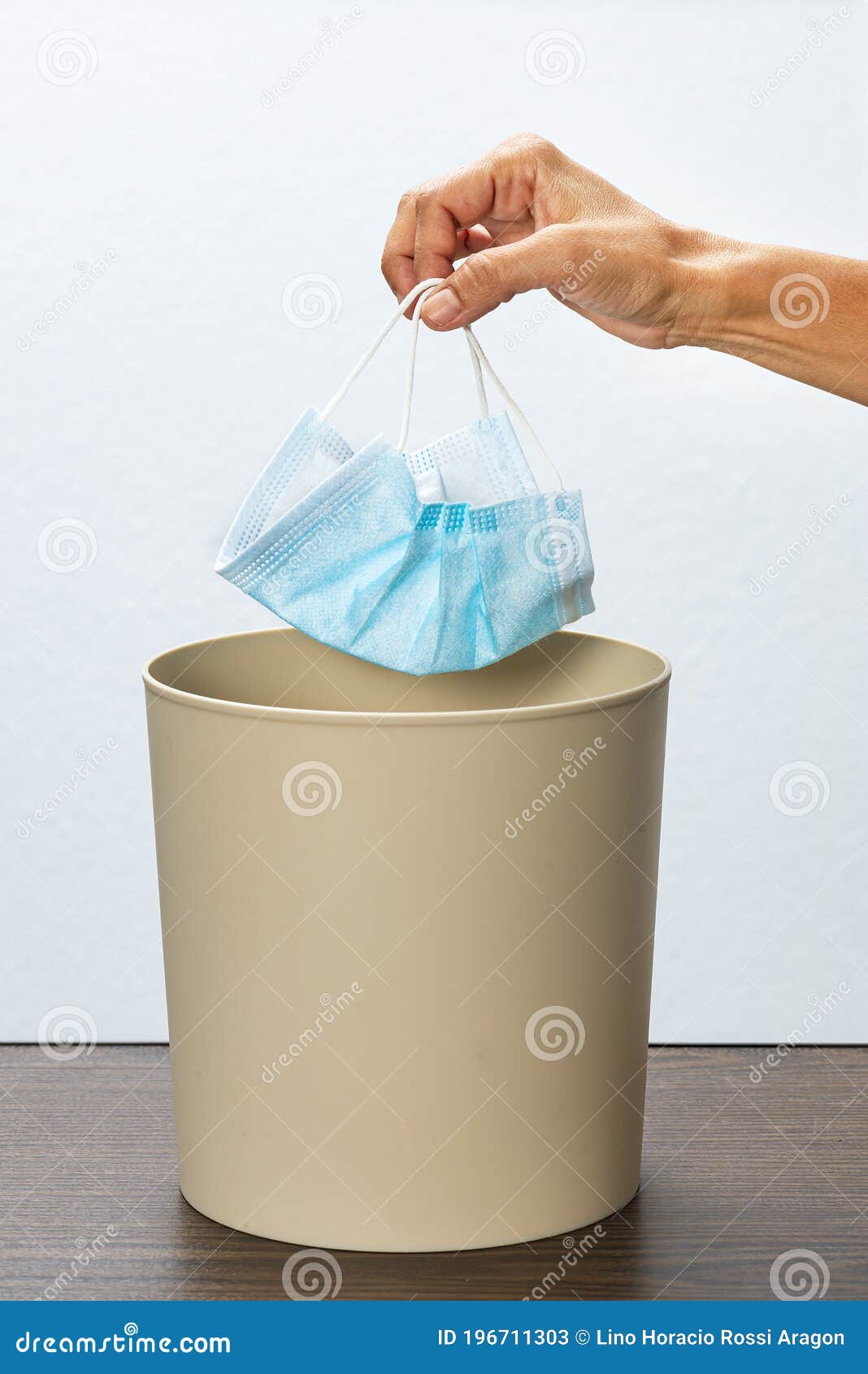 Woman Throwing a Mask into the Garbage Can Stock Image - Image of ...