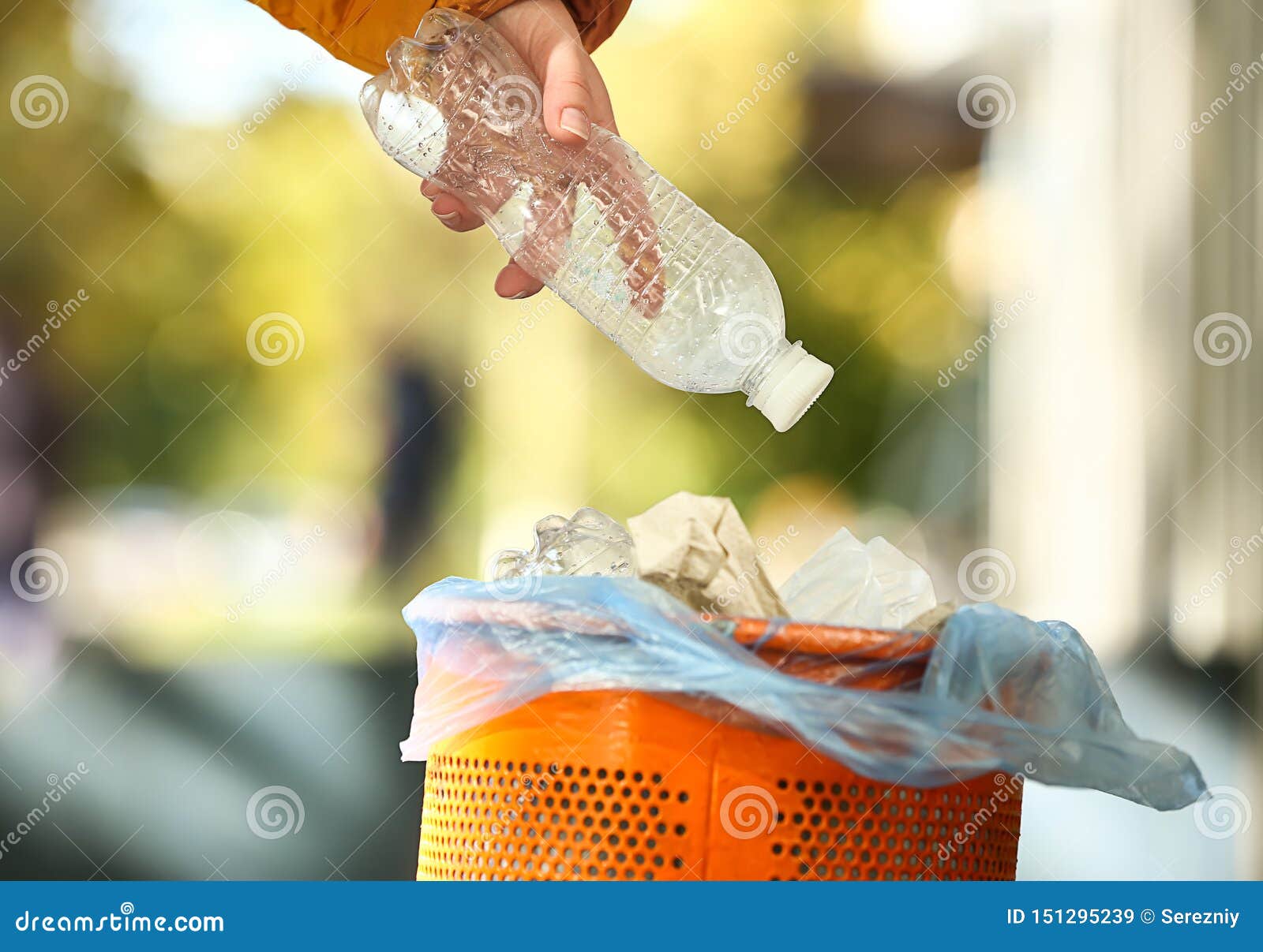 Woman Throwing Plastic Bottle into Garbage Bin Outdoors Stock Image ...