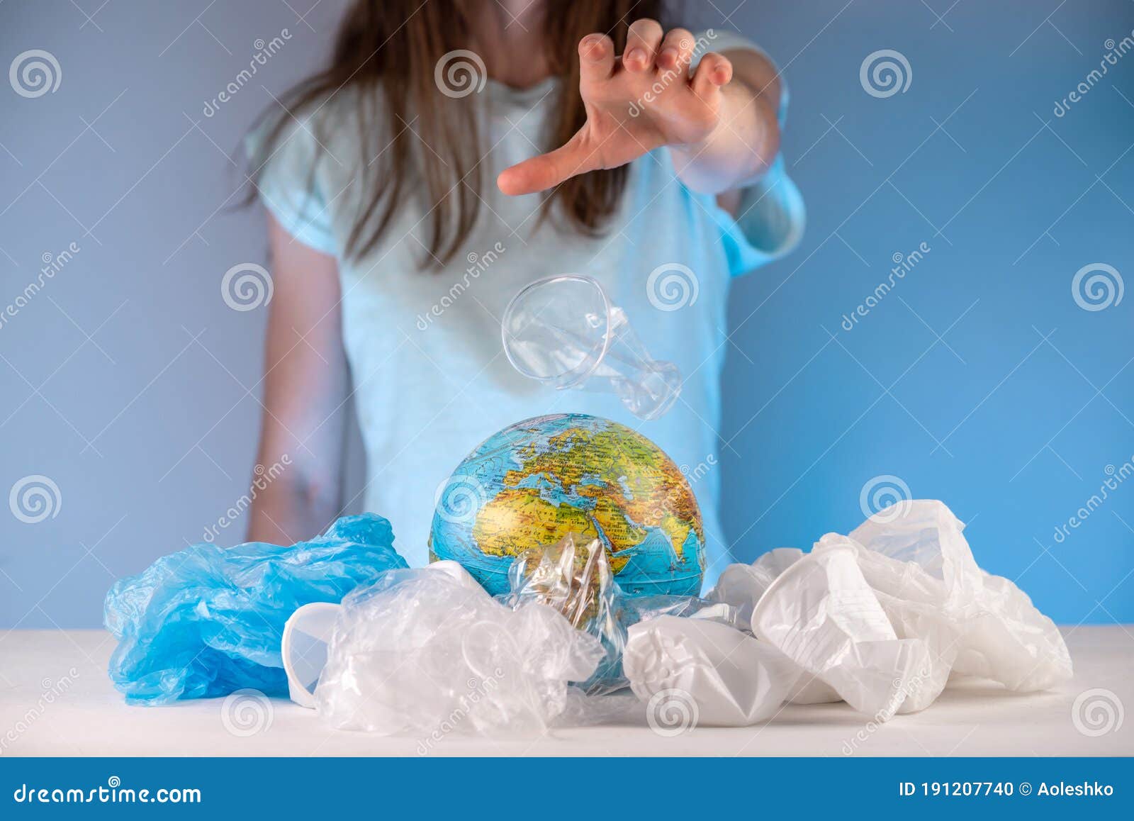 Woman is Throwing the Plastic on the Earth that is in a Pile of Garbage ...
