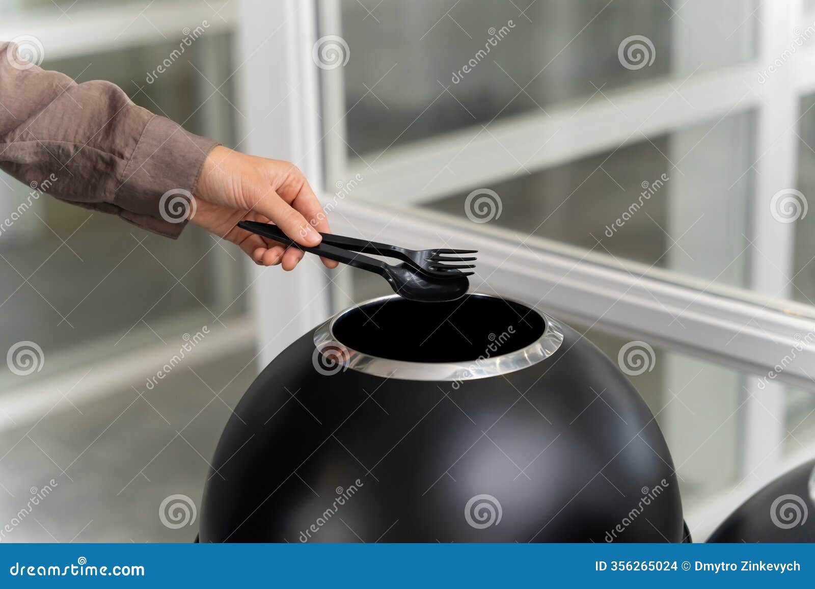 Woman Throwing Plastic Fork and Spoon To the Proper Container for ...