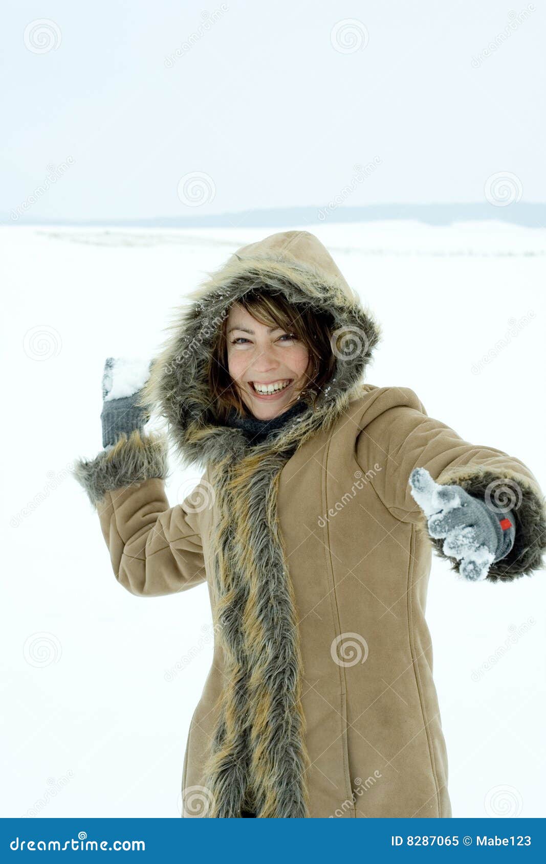 Woman throwing snowball stock image. Image of hood, winter - 8287065
