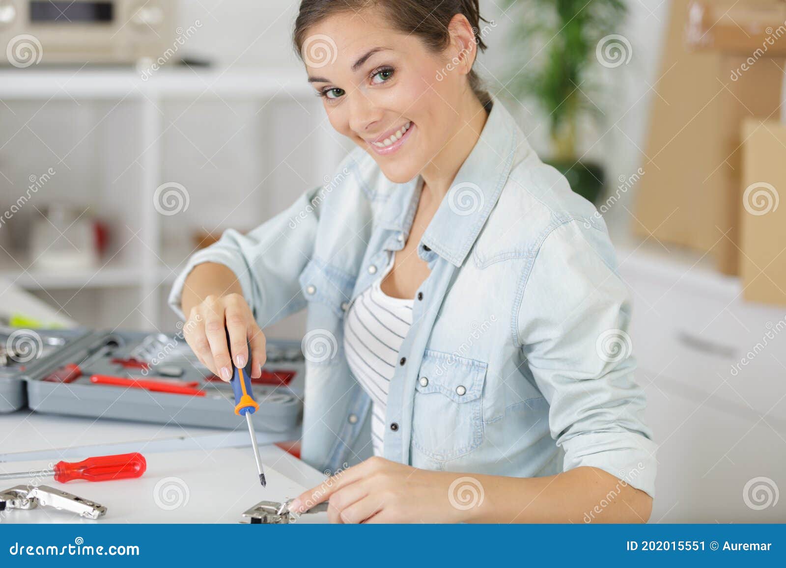 Woman with tool to repair stock image. Image of lifestyle - 202015551
