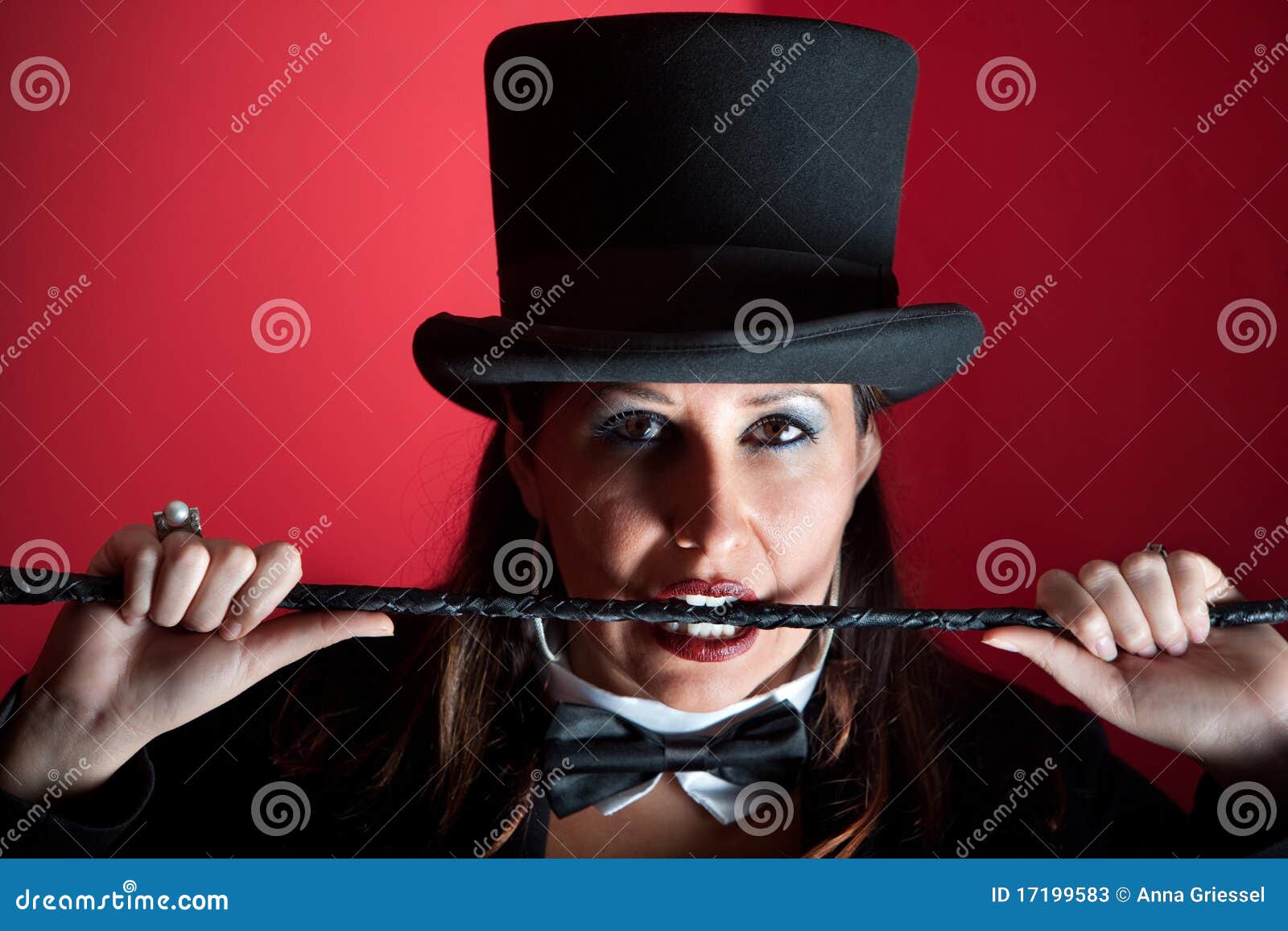 Woman in Top Hat Biting Whip Stock Image - Image of circus, caucasian ...