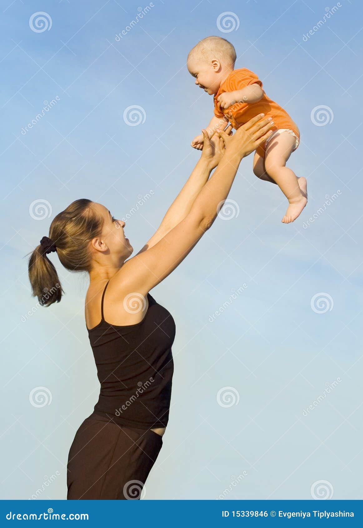 A woman tosses a child stock photo. Image of tosses, parenthood - 15339846