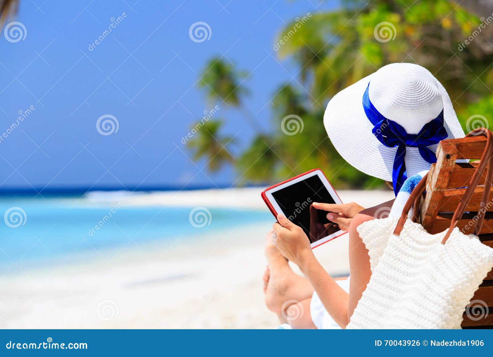 Woman with Touch Pad on Tropical Beach Stock Photo - Image of remote ...