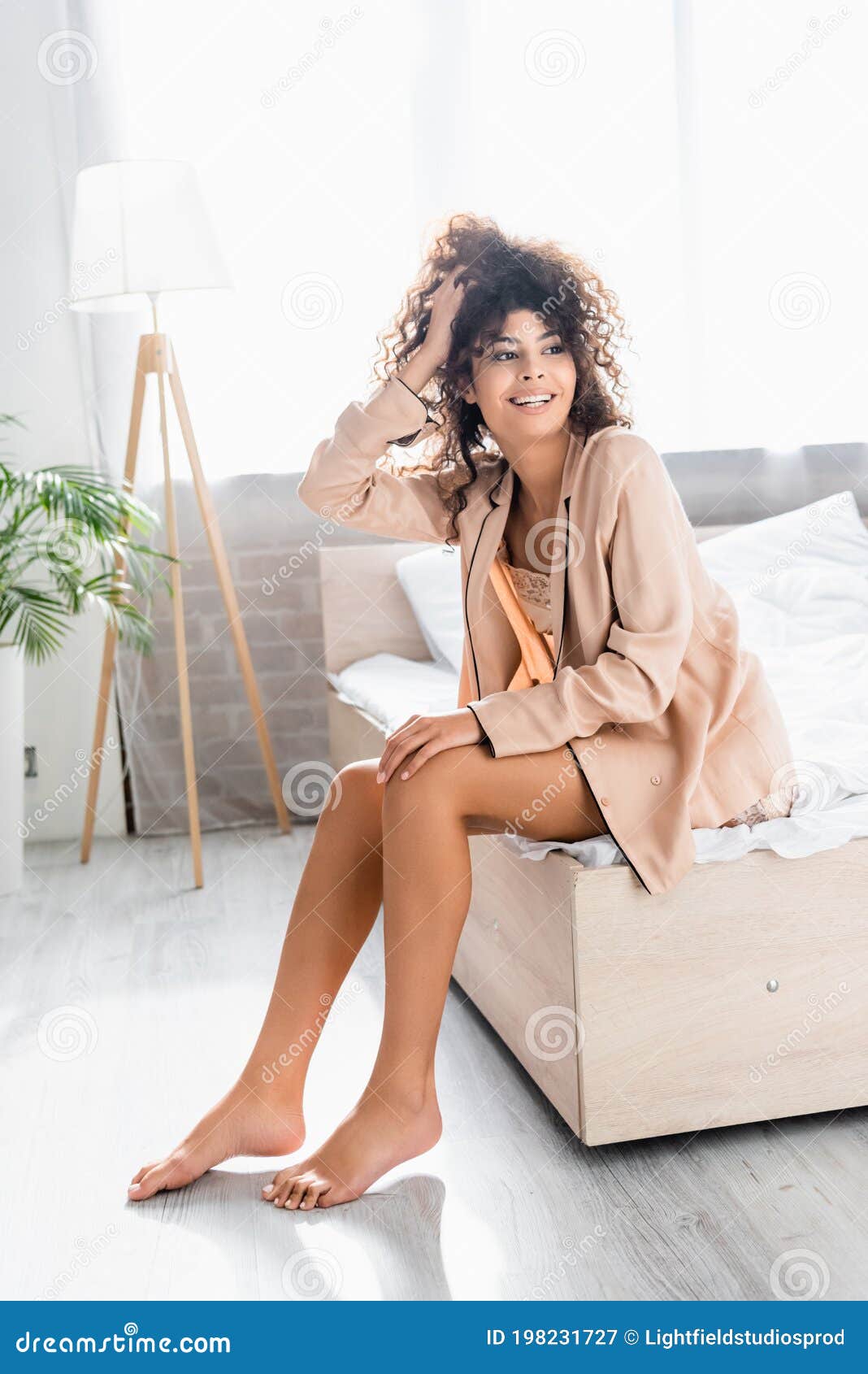 Woman Touching Curly Hair And Sitting Stock Image Image Of Curly