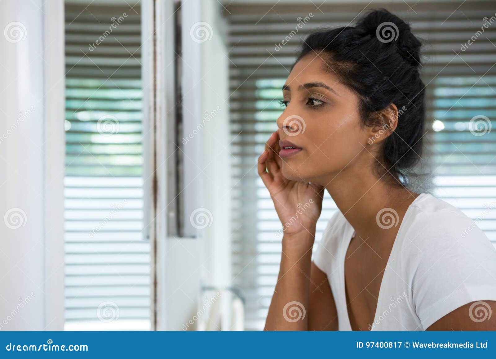 Woman Touching Face in Bathroom Stock Image - Image of glass, homey ...