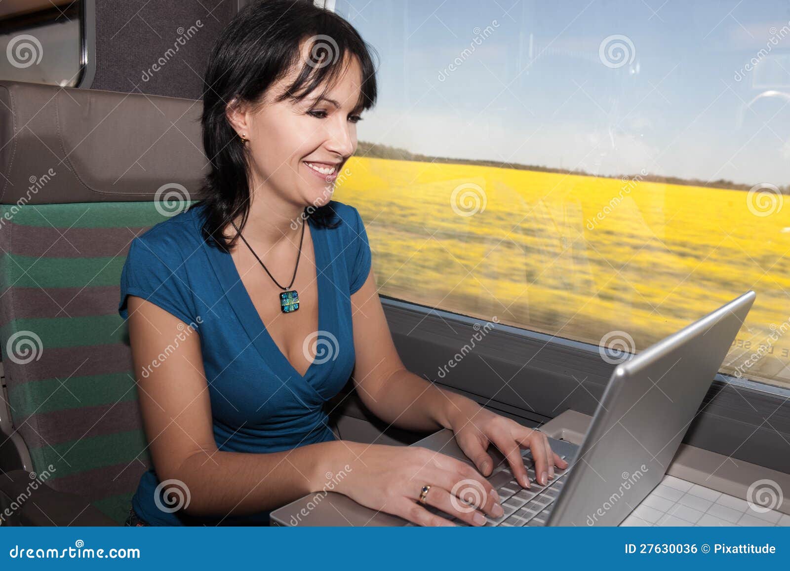 Woman in a Train Computing Laptop Computer Smiling Stock Photo - Image ...