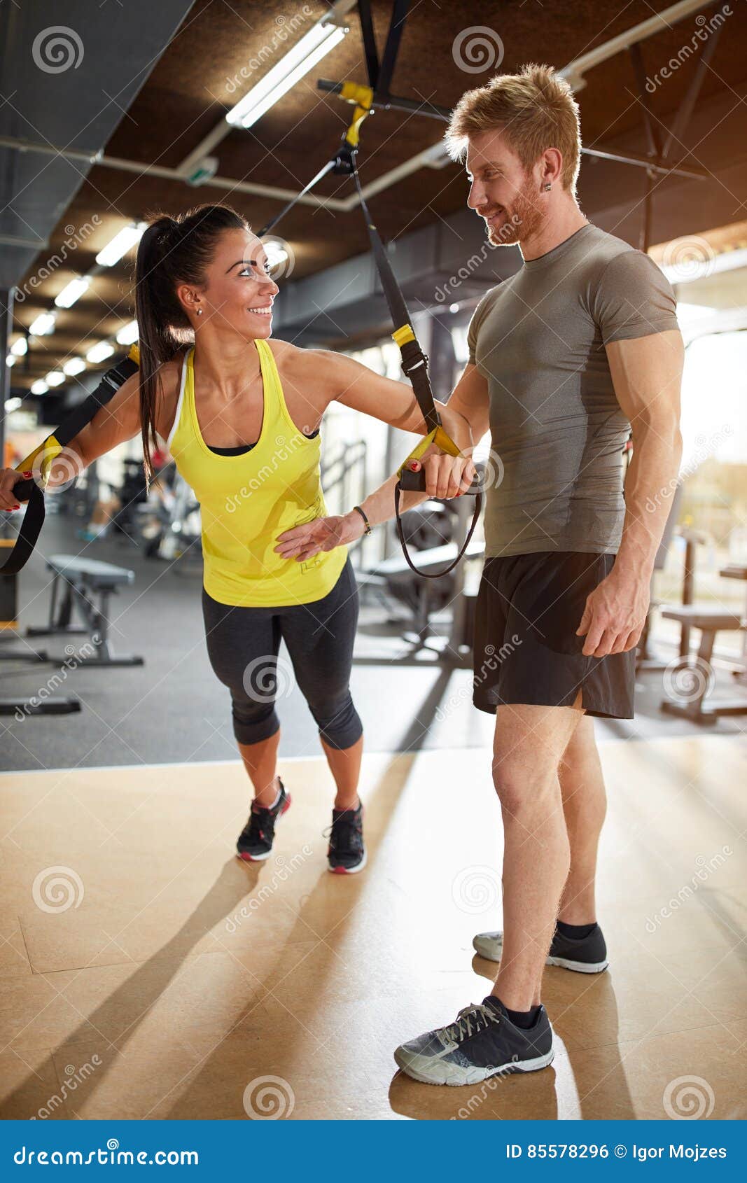 Woman Train in Gym with Trainer Assisting Stock Photo - Image of female ...