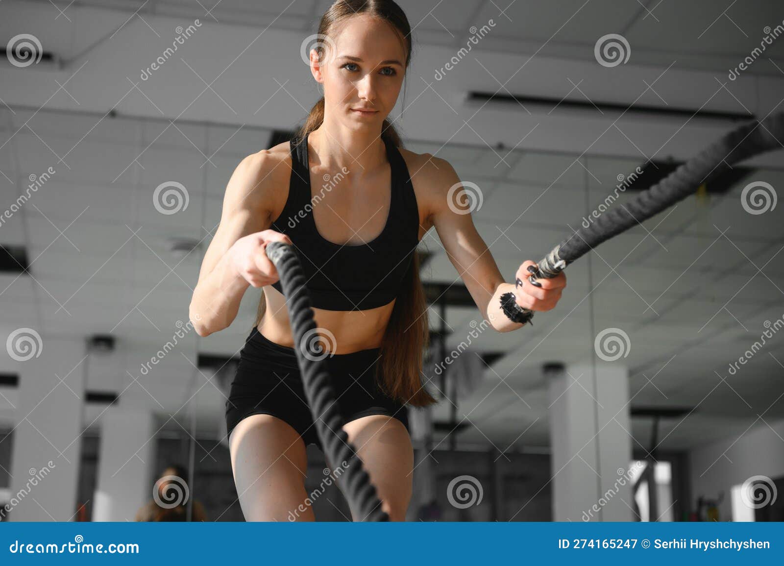 Woman Training with Battle Ropes in Gym Stock Image - Image of active ...