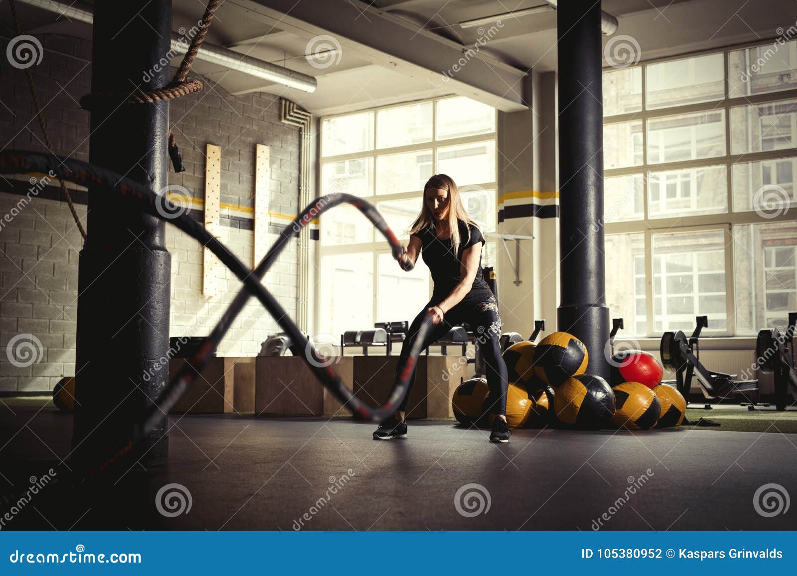 Woman Training with Battle Ropes in Gym Stock Photo - Image of ...